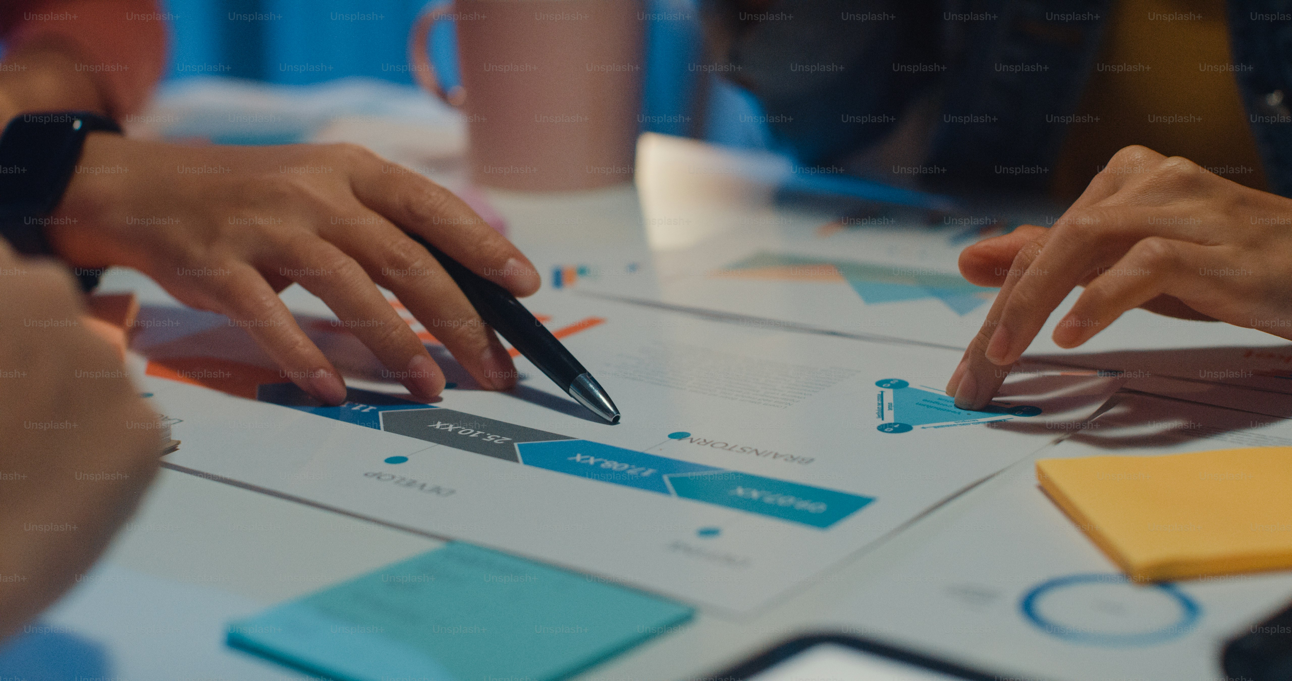 Millennial Asia people meeting brainstorming ideas about new paperwork ...