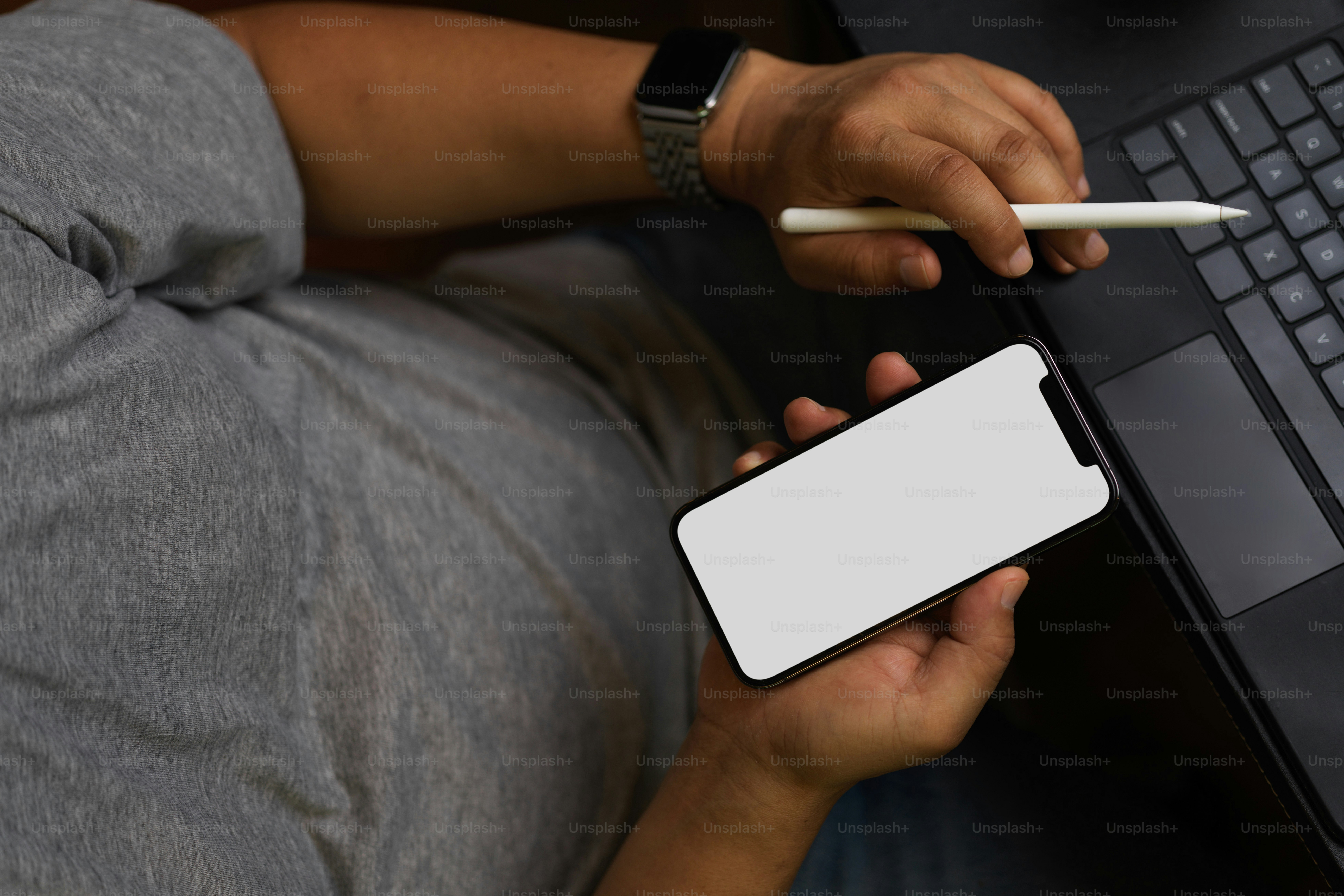 Success man in casual sitting and using smartphone to work, phone blank ...