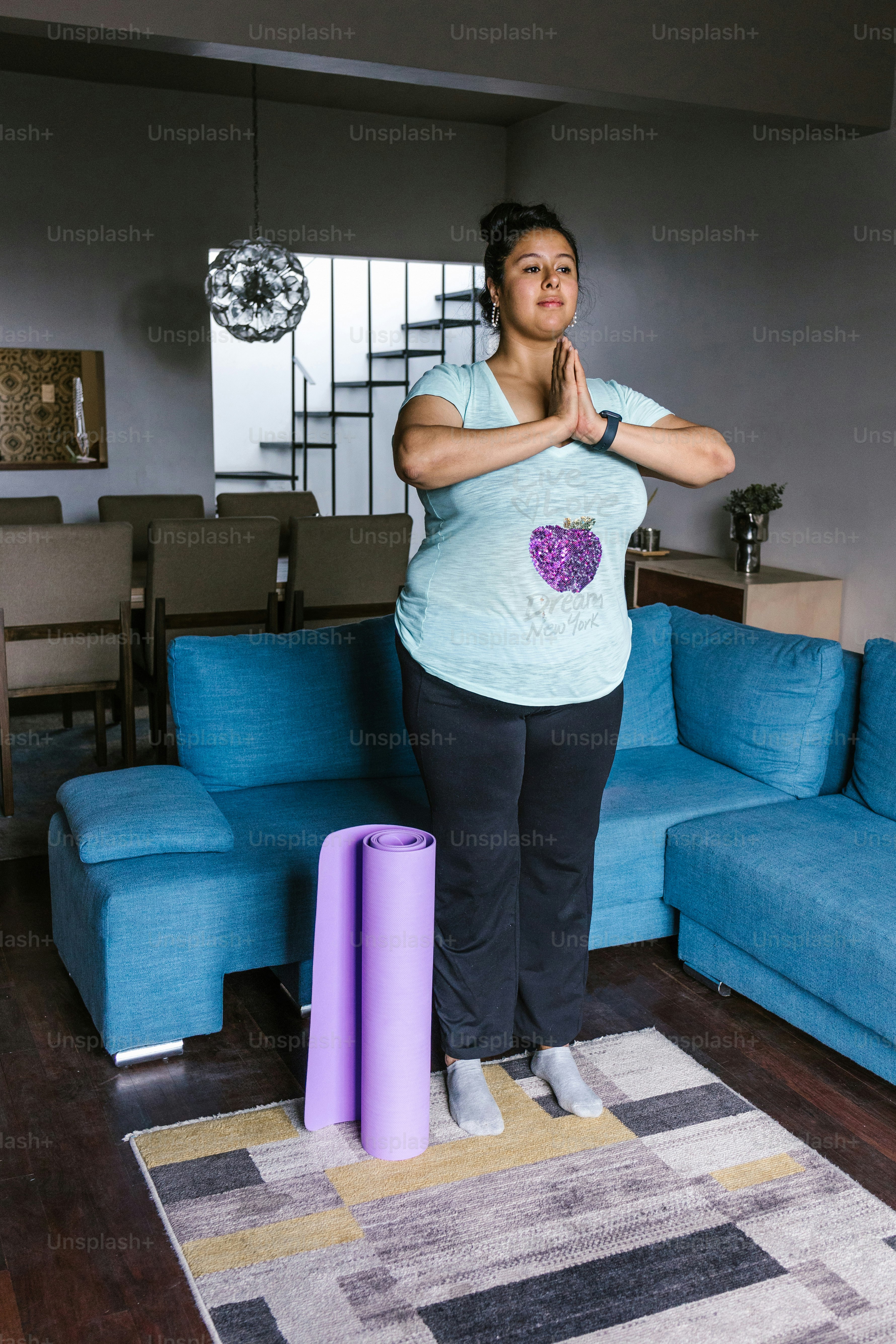 Young curvy mexican woman standing meditating at home in Mexico photo ...