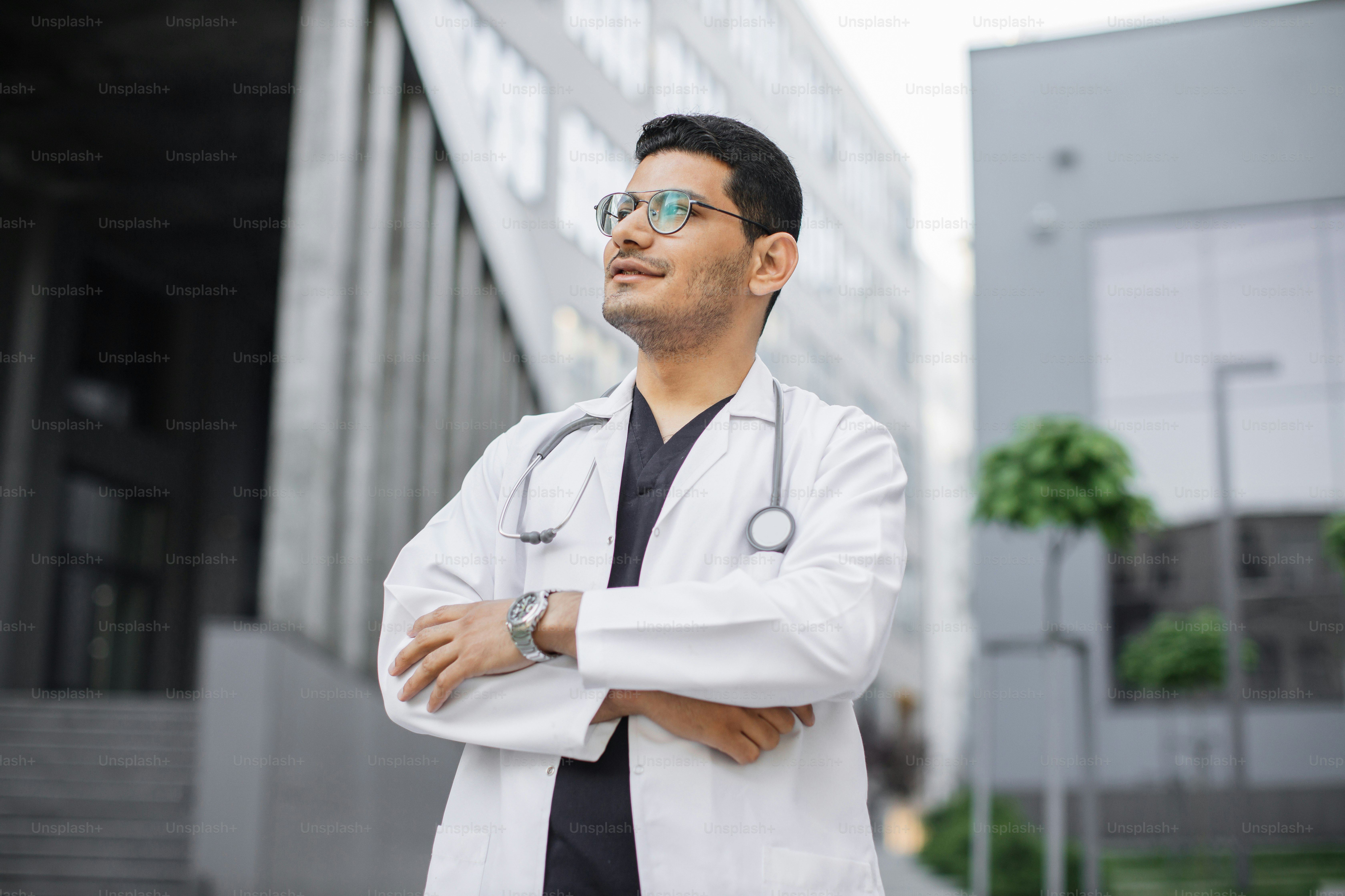 Close up portrait of young professional male Arabian doctor, wearing ...
