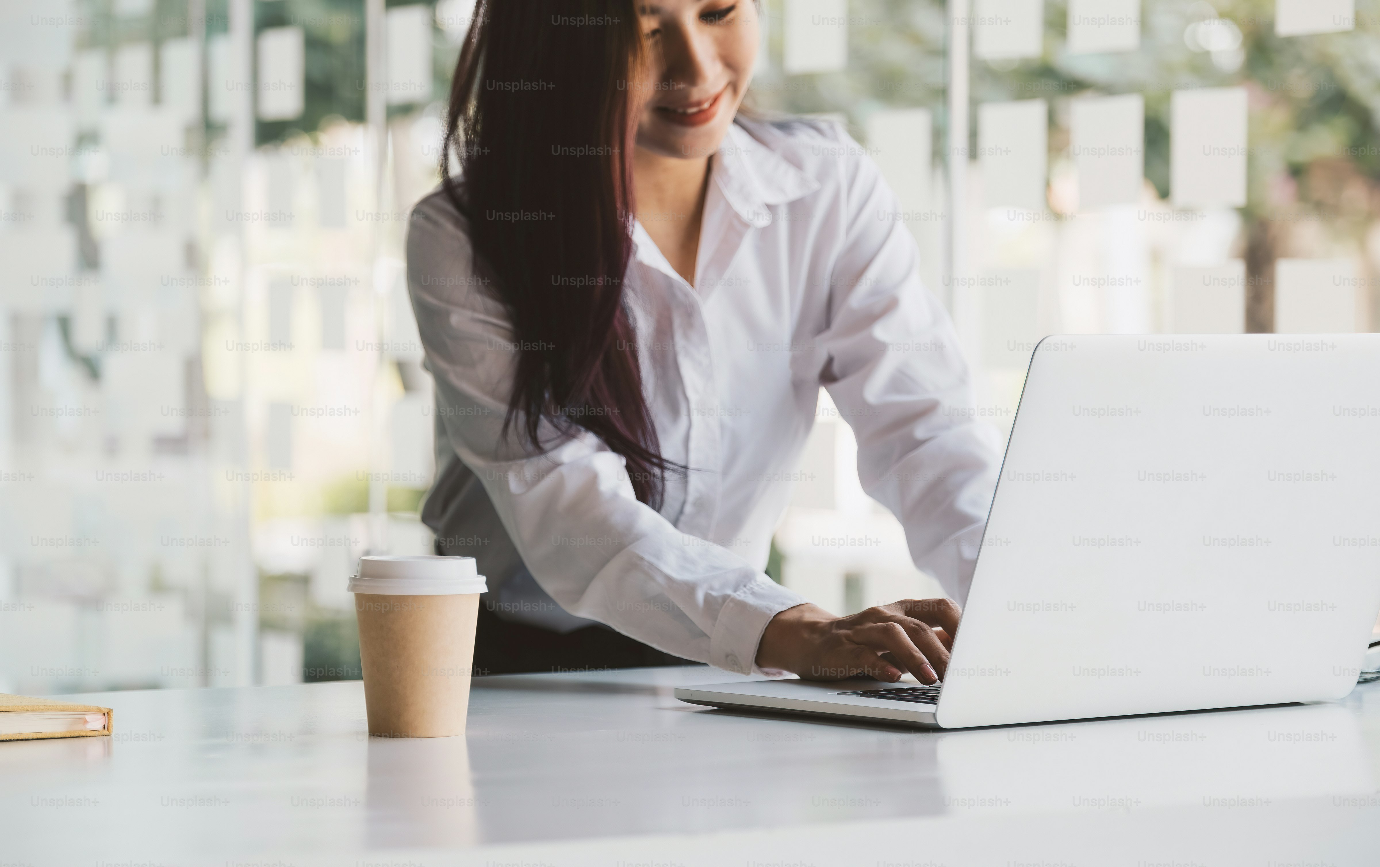 Close up woman using laptop computer on workplace. photo – Technology ...