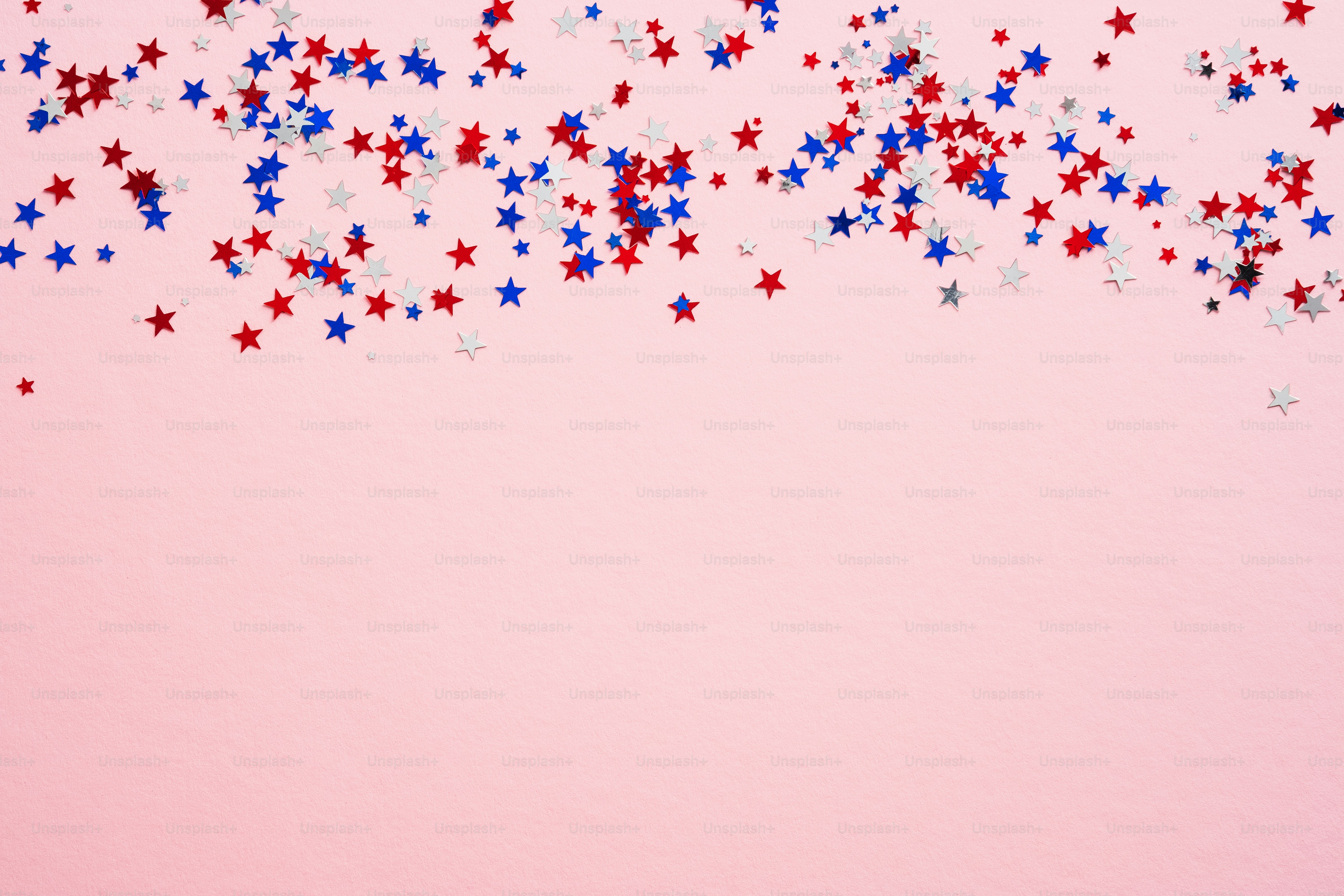 Happy Veterans Day concept. USA colors confetti stars on pink ...