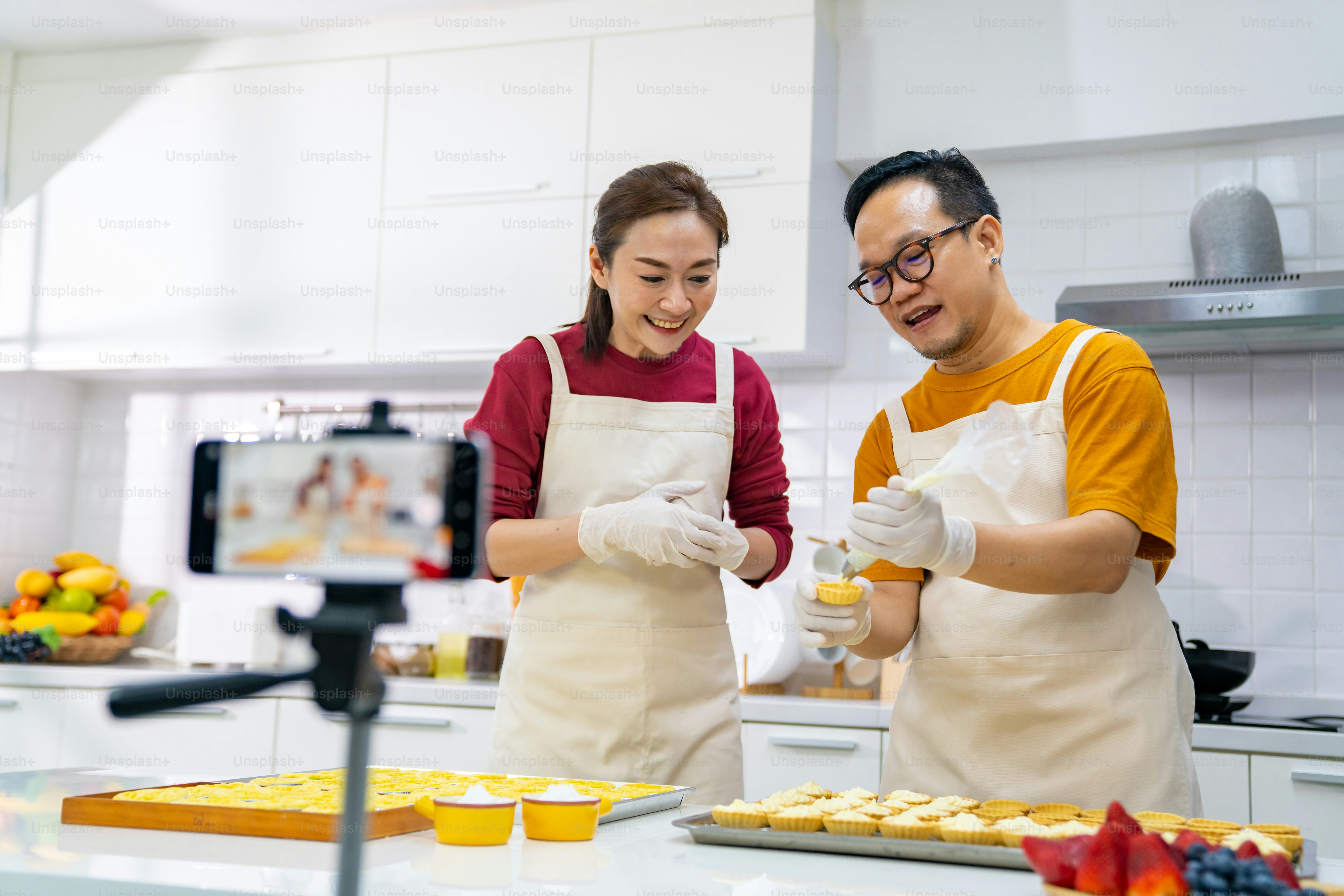 Asian couple bakery shop owner using smartphone with internet vlogging ...
