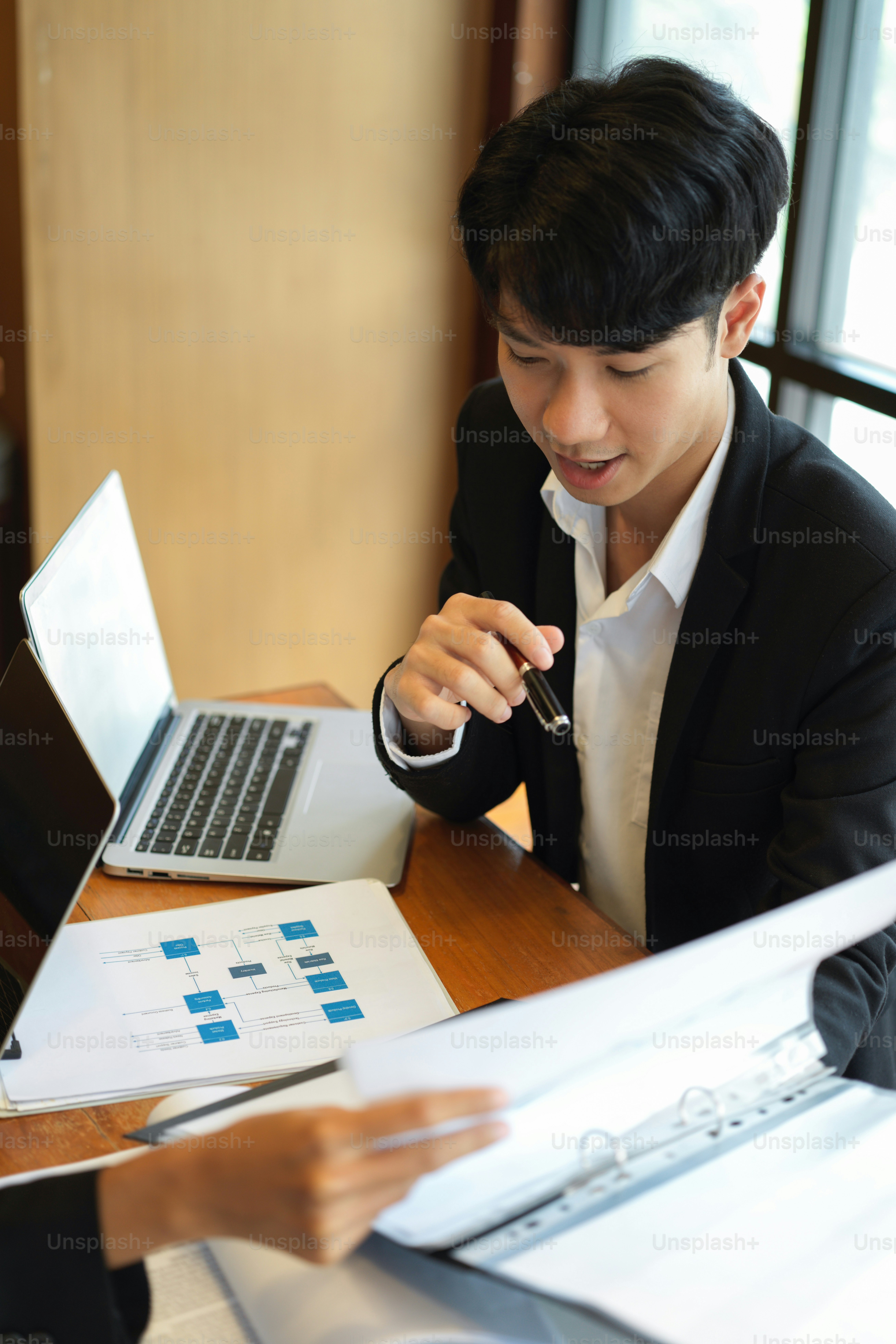 Portrait of an Executive board member reviewing documents in a document ...
