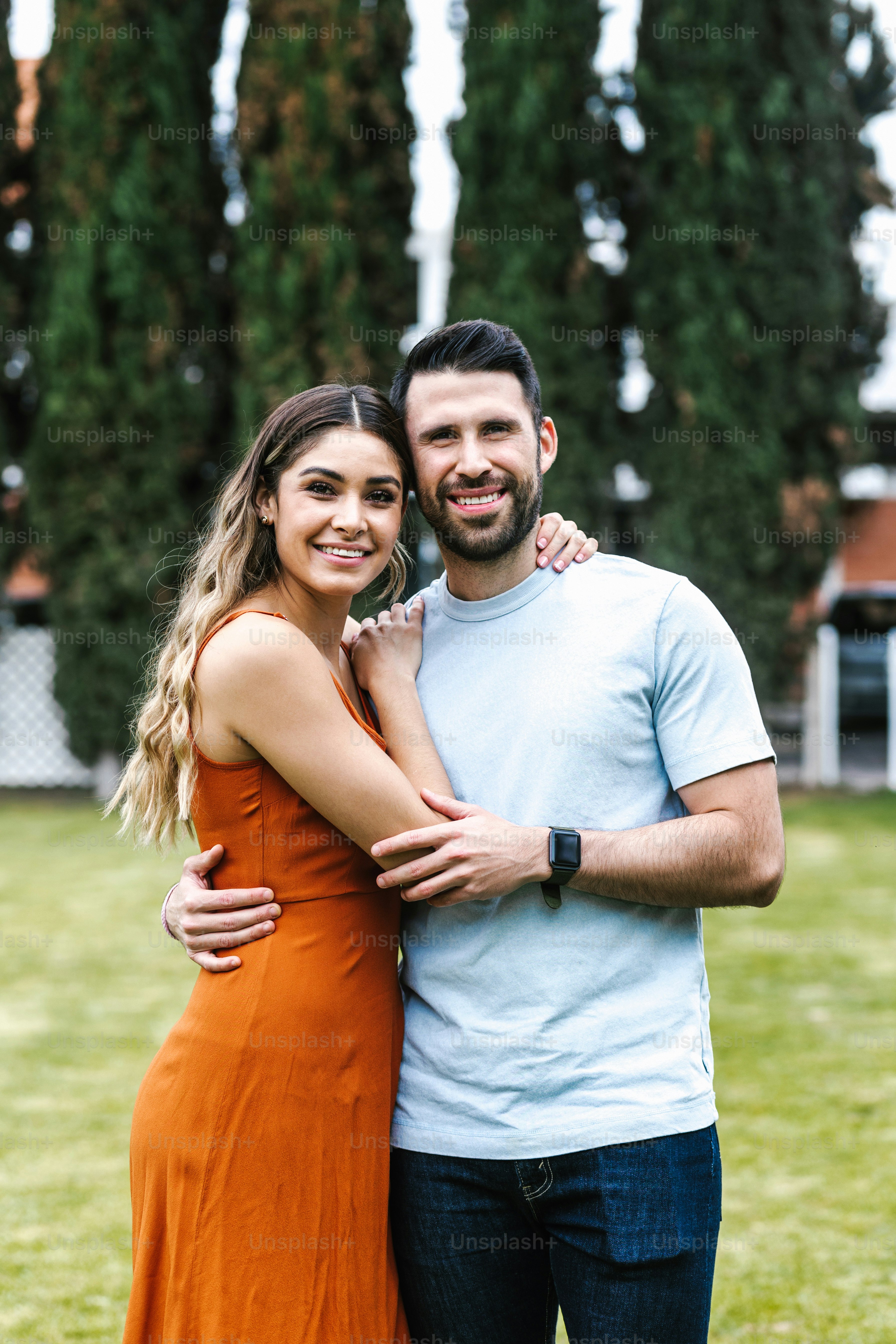Young latin couple in love having fun and enjoying the beautiful nature ...