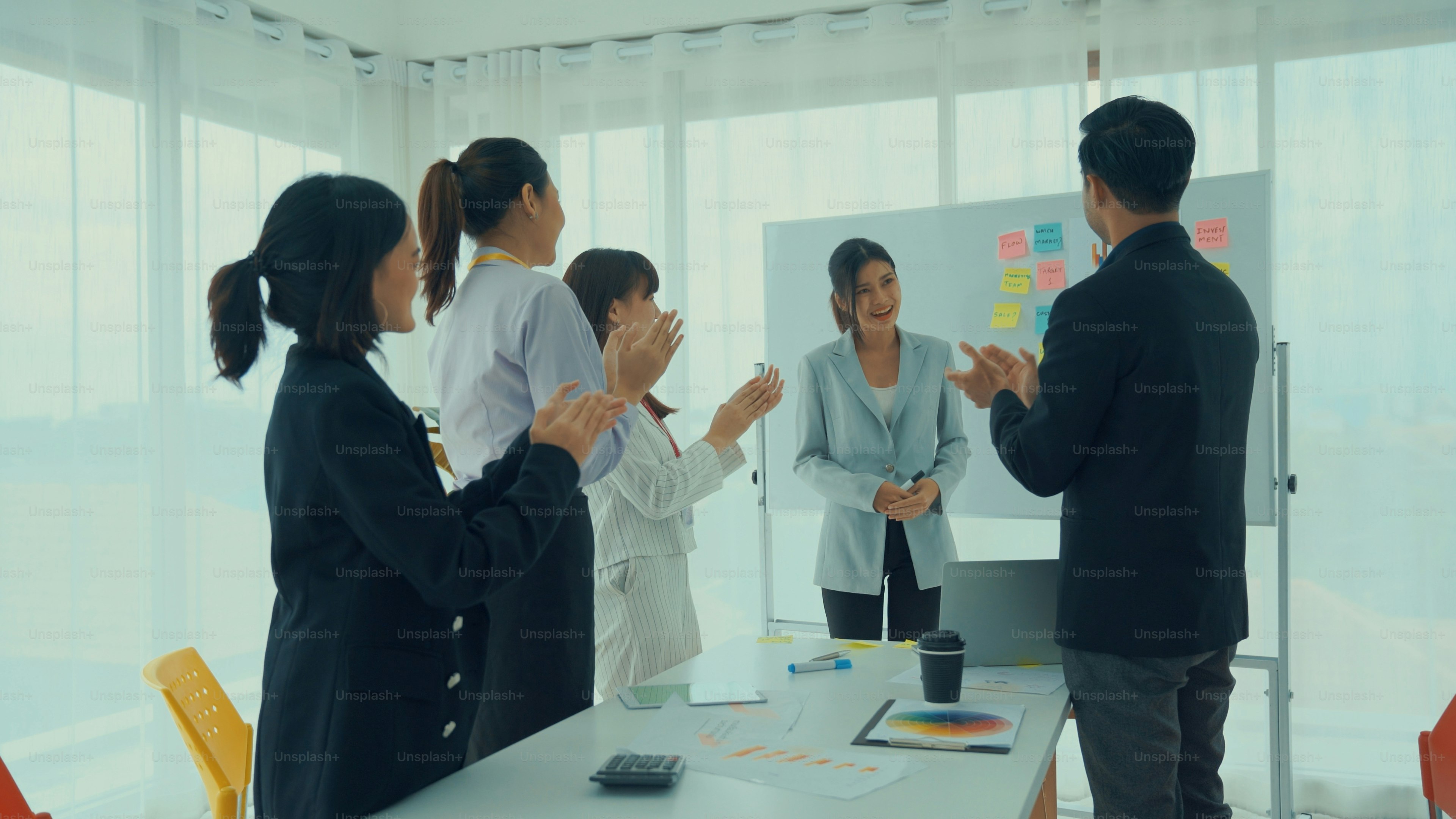 Businesswoman proficiently present work project receive celebrations ...