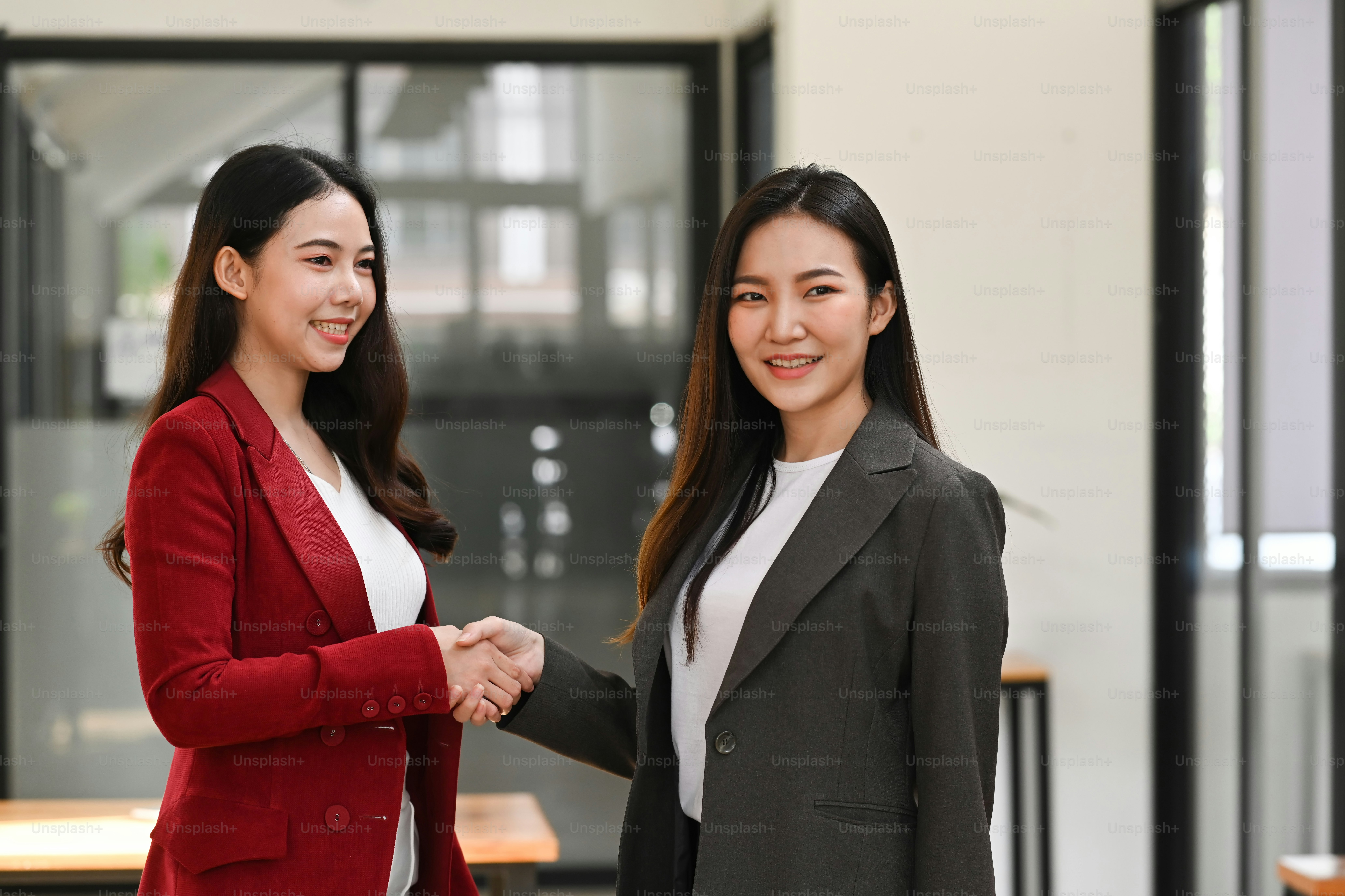 Business partners shaking hands after after negotiations. photo ...