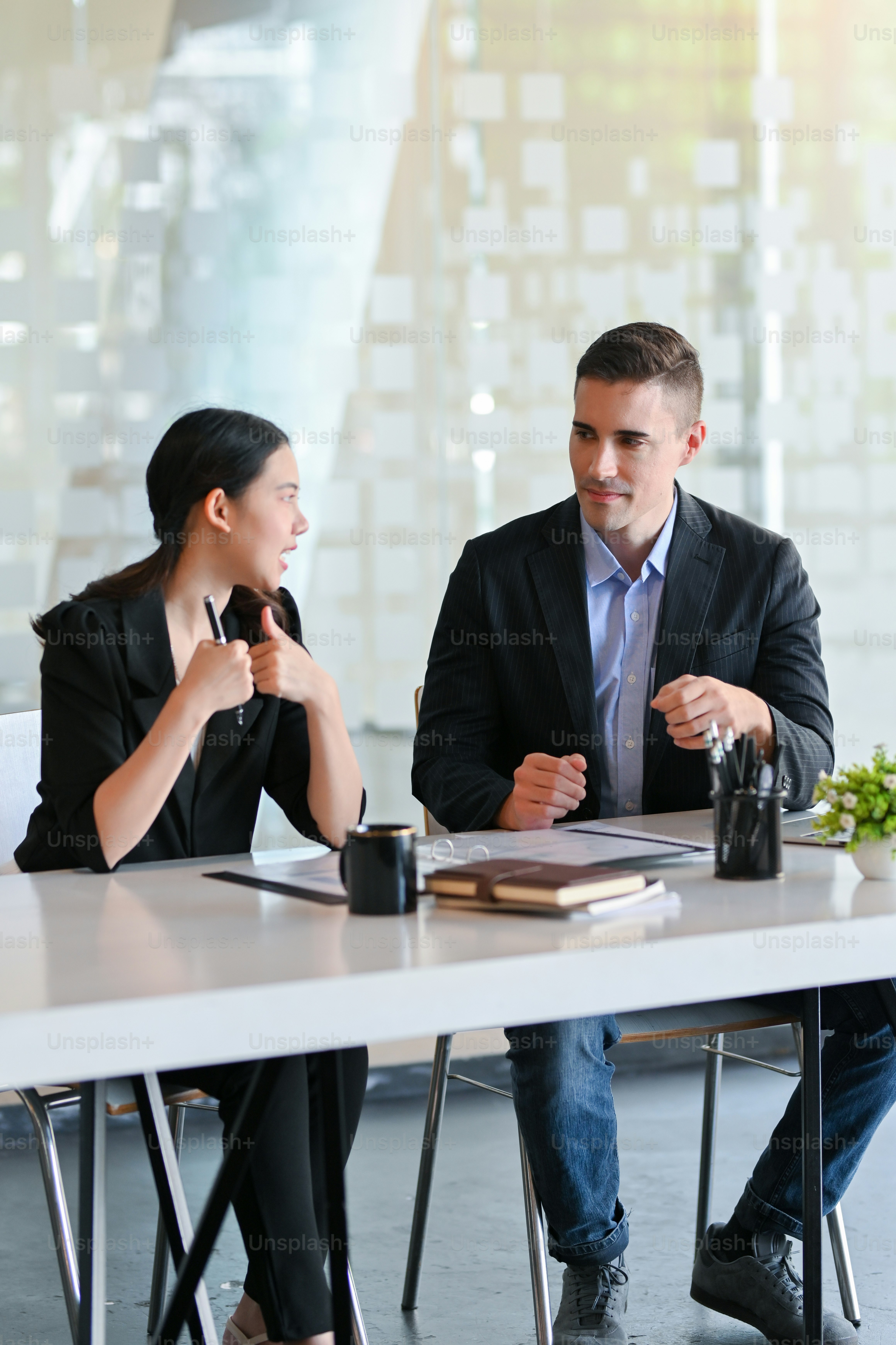Businesswoman and businessman having a great conversation during coffee ...