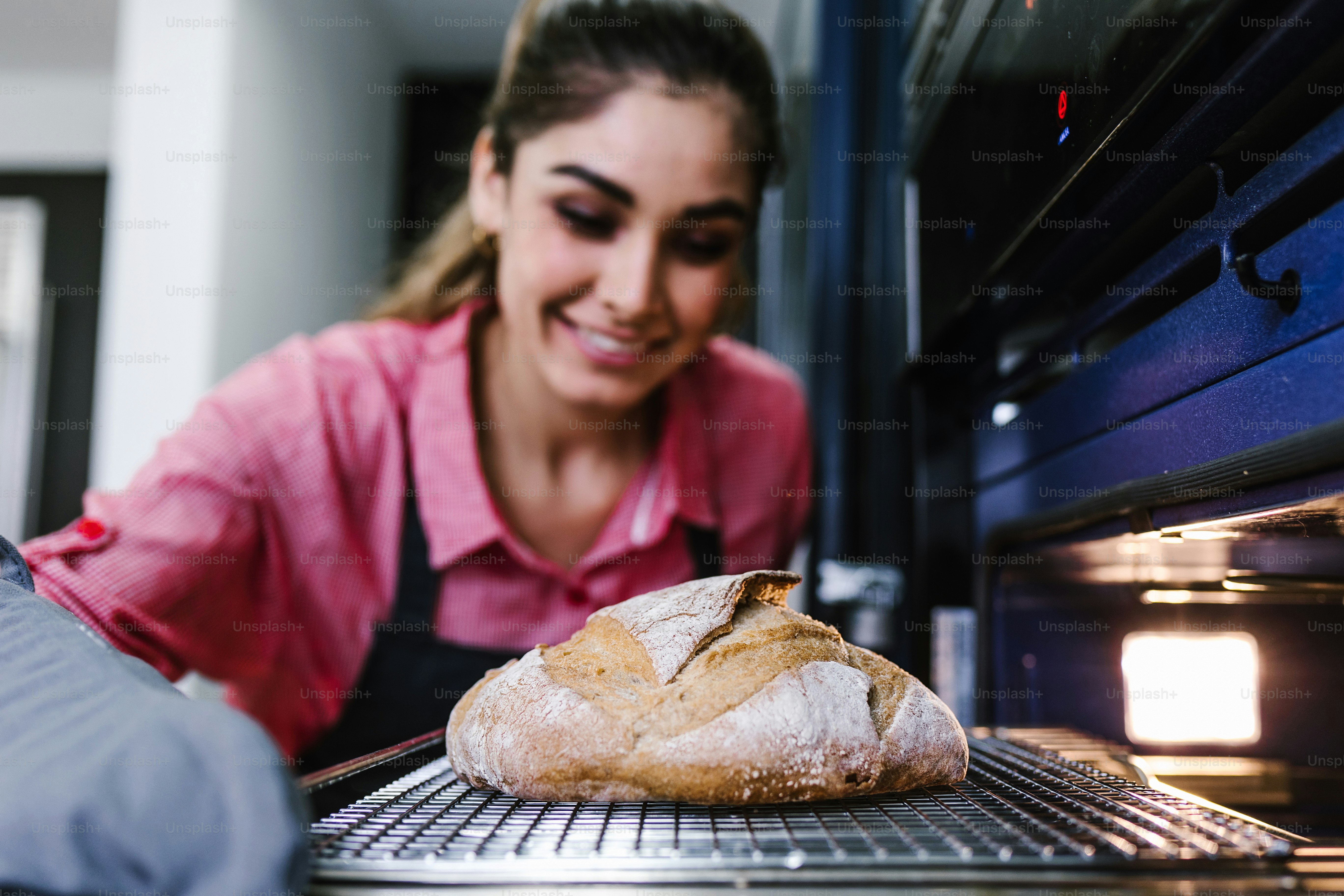 Young Latin woman baking bread and ingredients in kitchen in Mexico ...