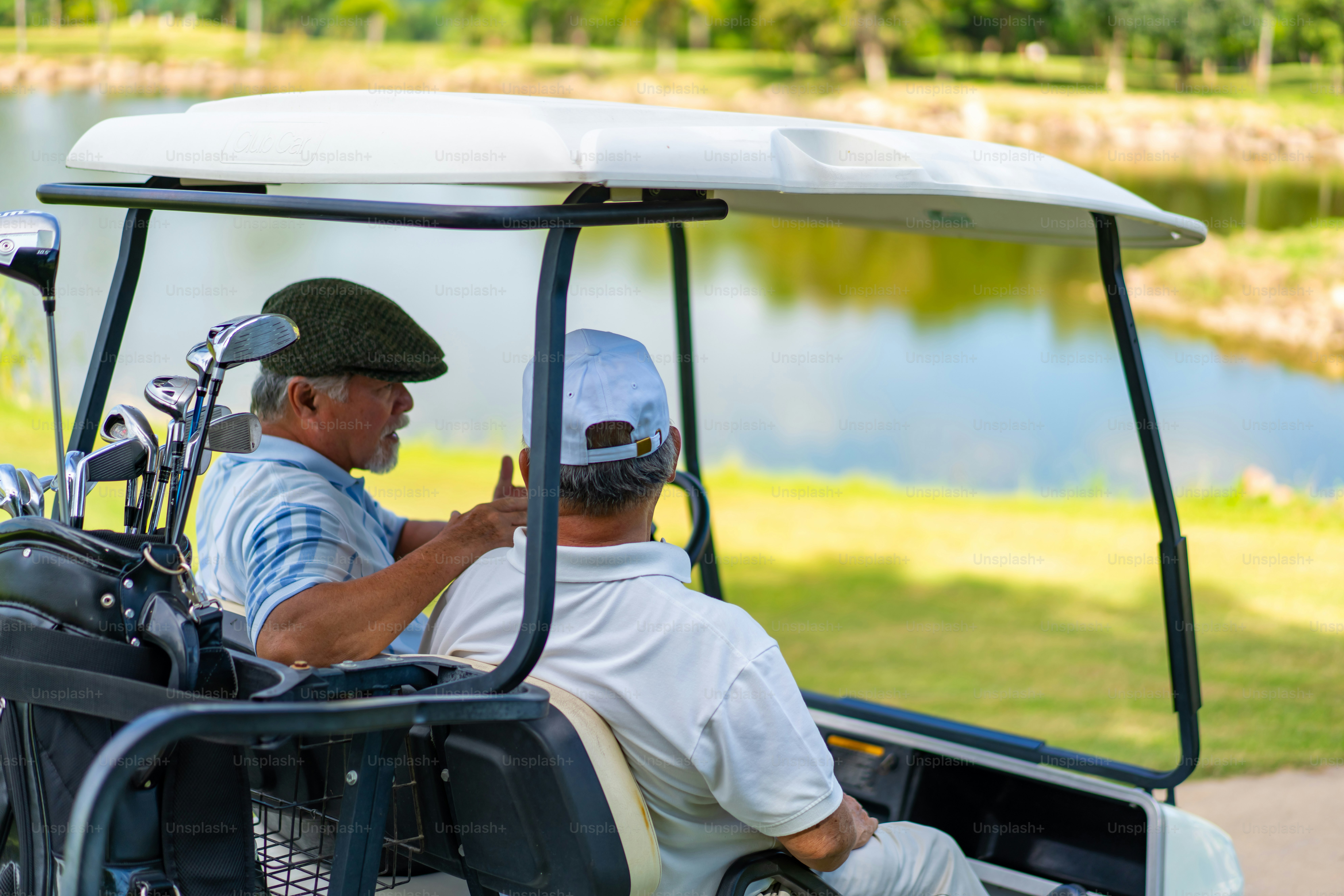 Group of Asian people businessman and senior CEO golfing near the hole ...