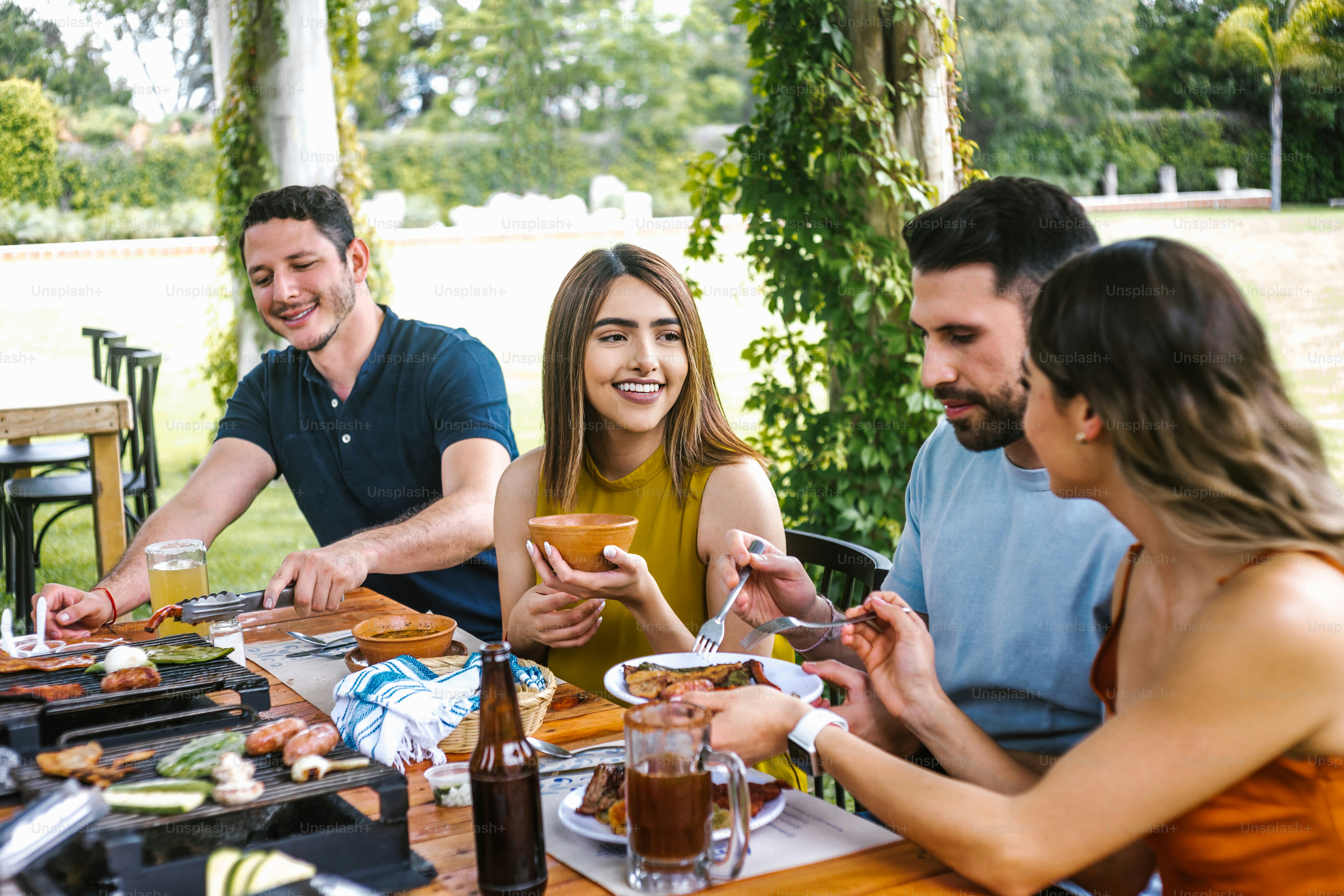 Group of Young latin Friends Meeting For beer, michelada Drinks And ...