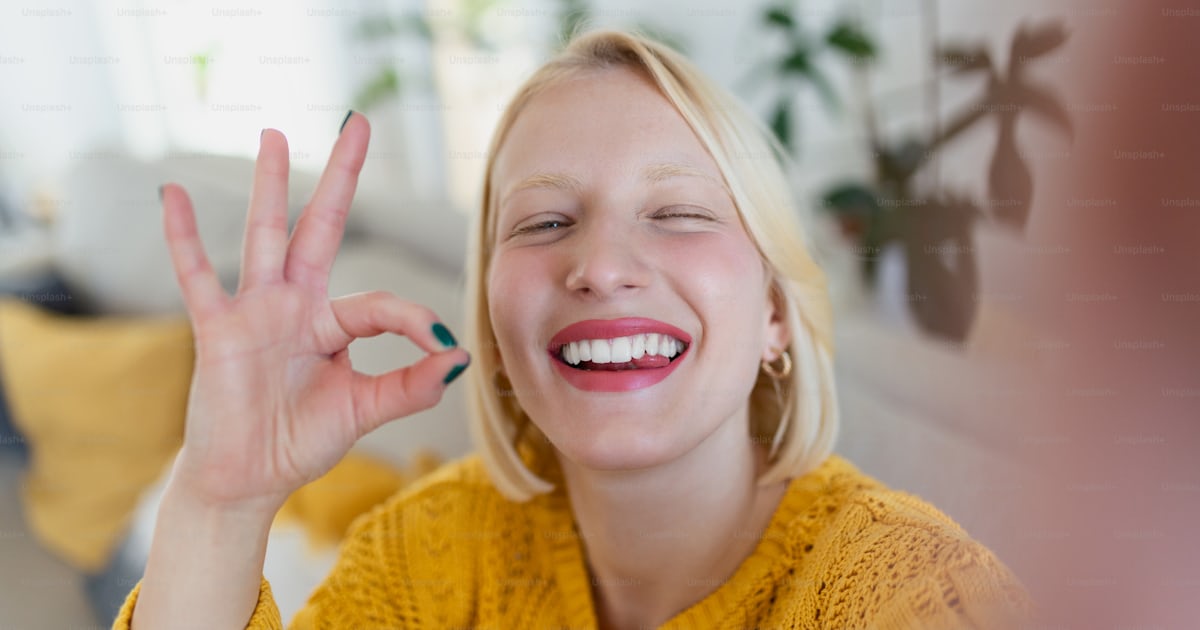 Mischievous Young Woman Takes Selfie At Home Beautiful Blond Woman Ok