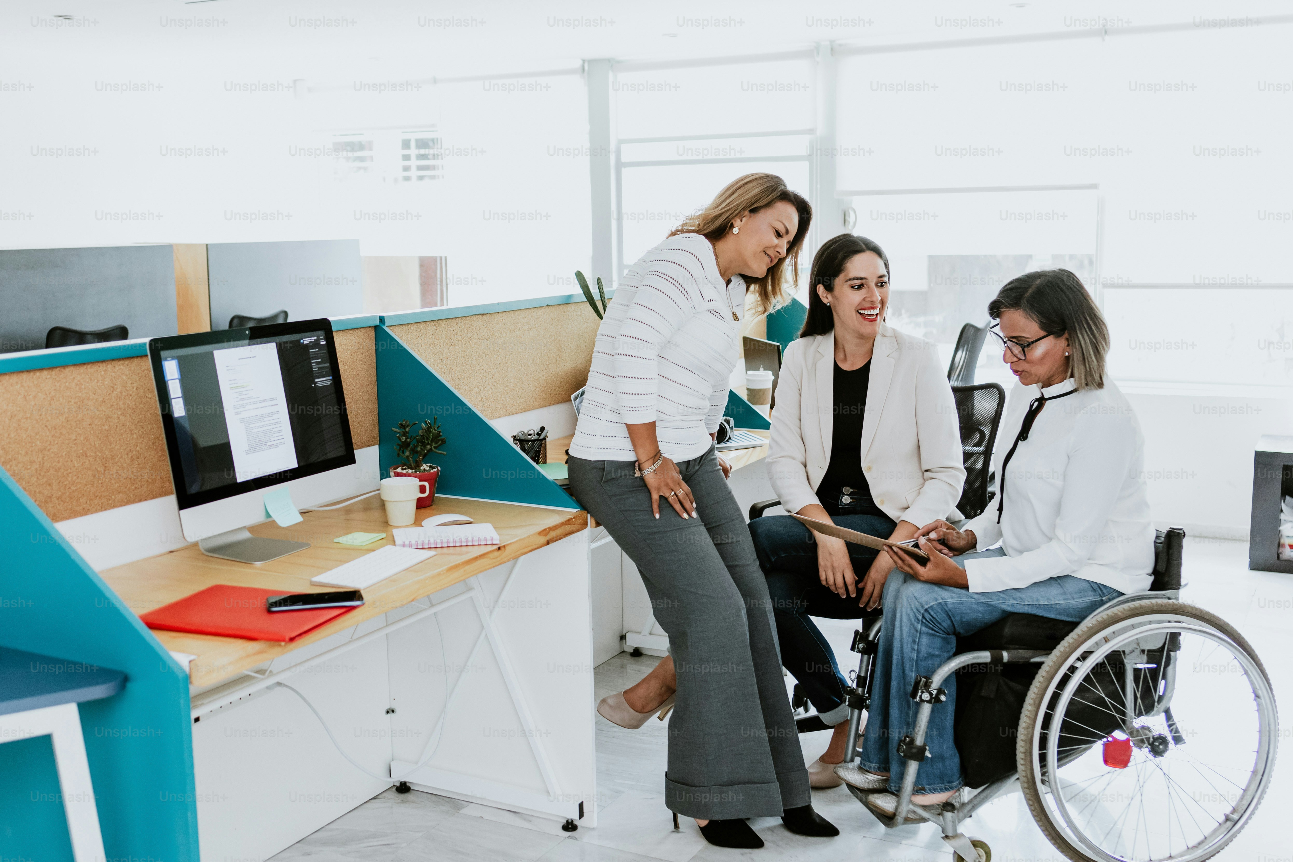 Transgender latin woman working with computer at the office in Mexico ...