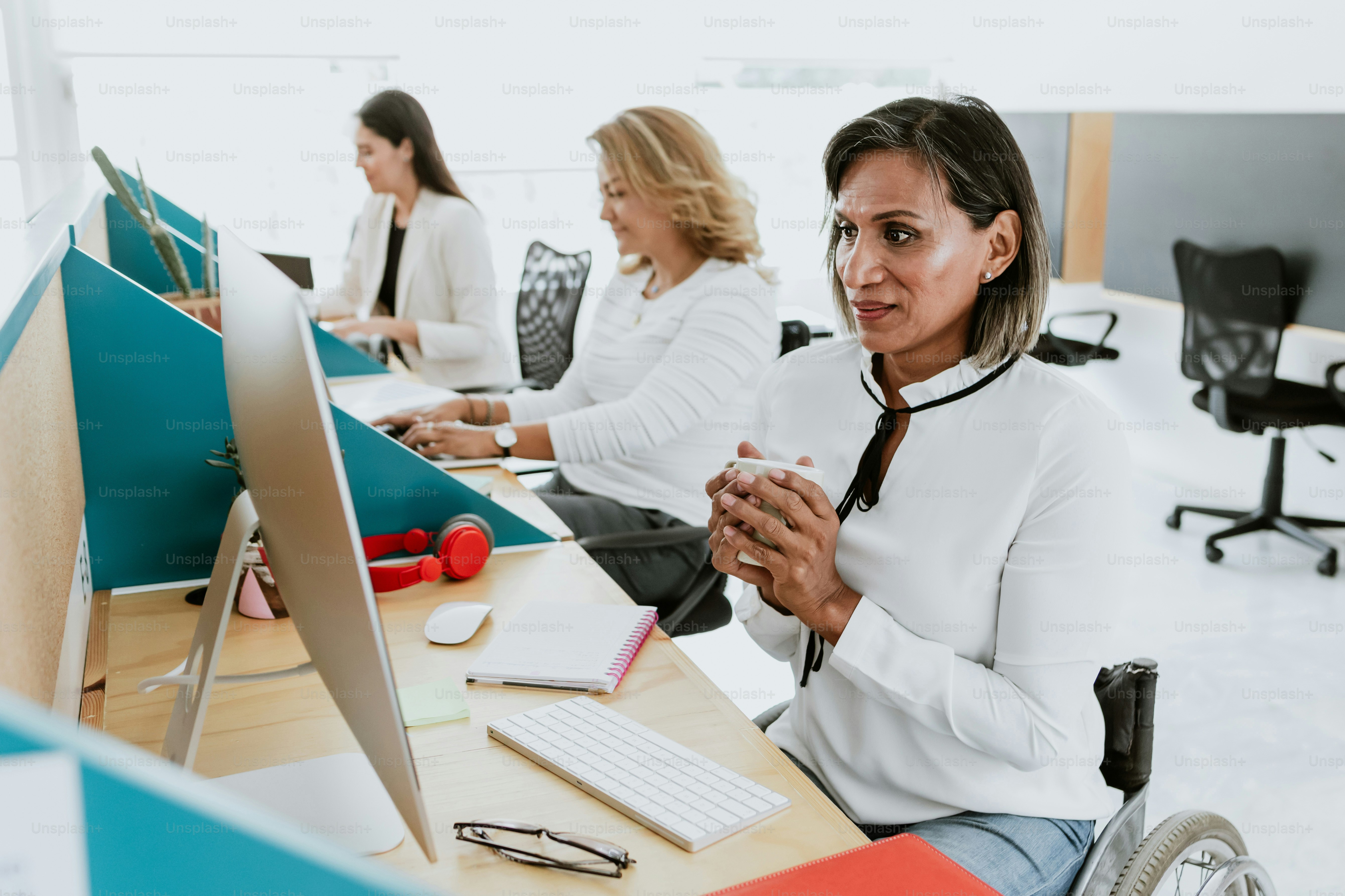 Transgender latin woman working with computer at the office in Mexico ...