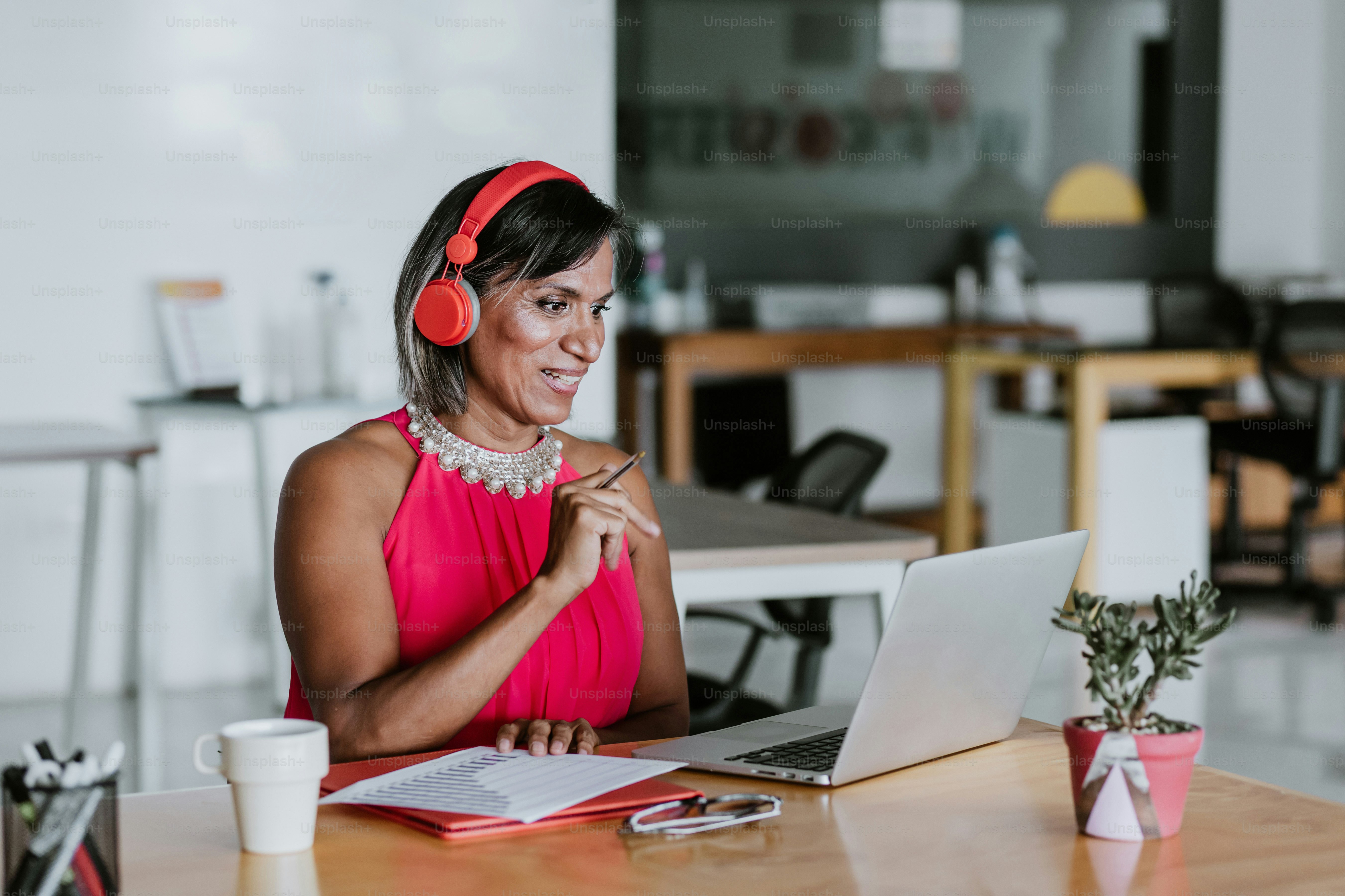 Transgender latin woman working with computer at the office in Mexico ...
