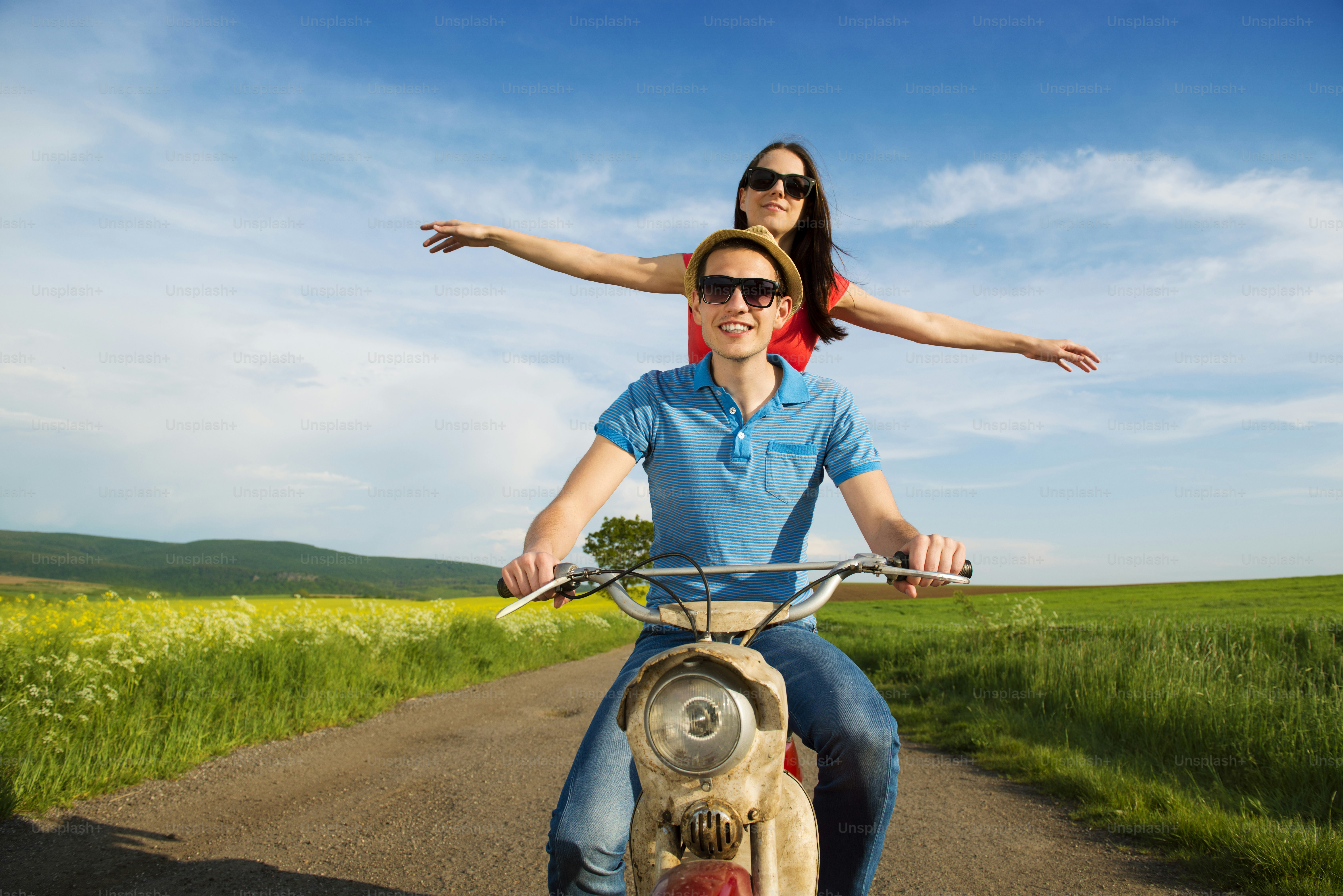 Two people riding a motorcycle on a road photo – Girlfriend and ...