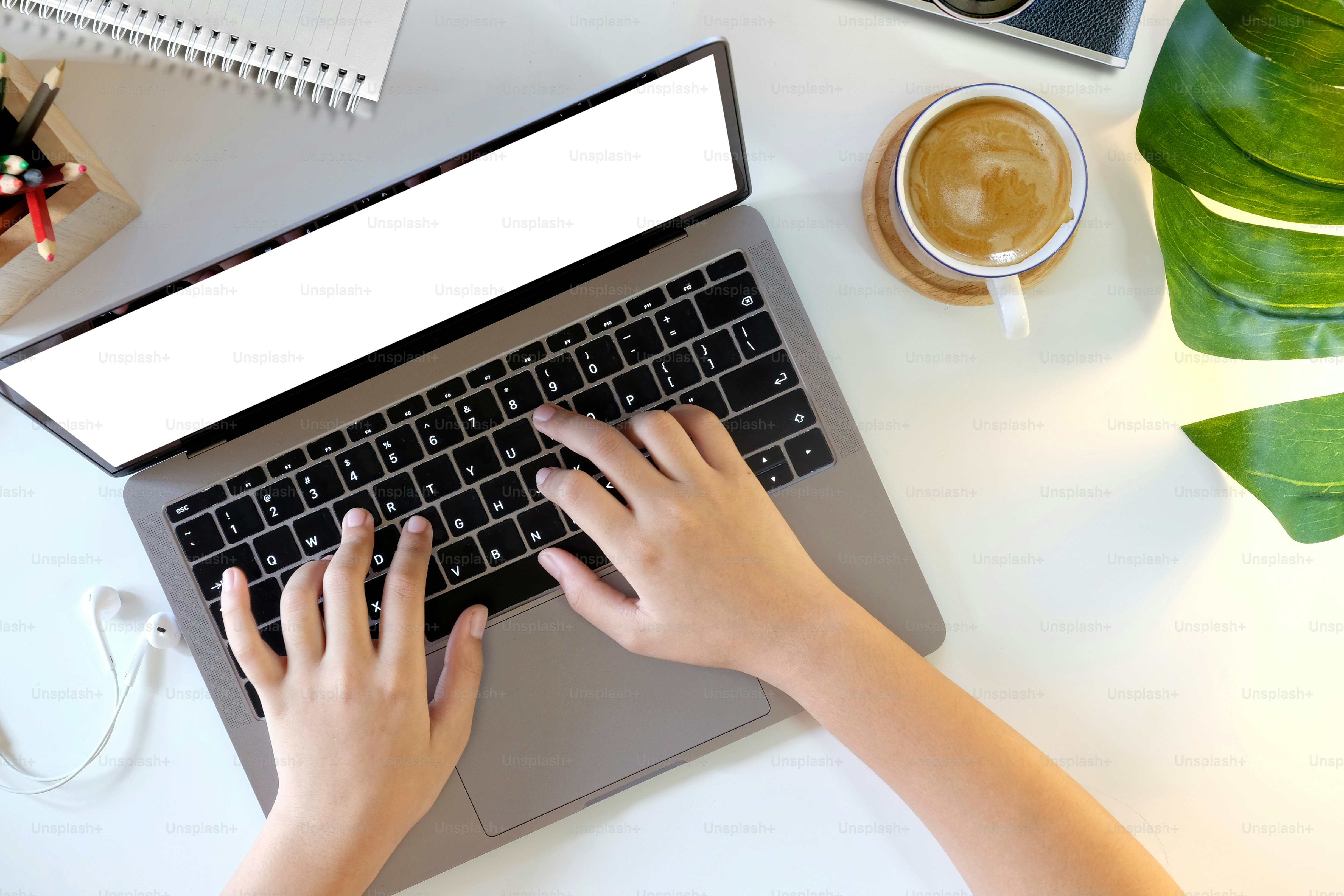 Top view workspace female hands typing laptop on woodendesk. Flat lay ...
