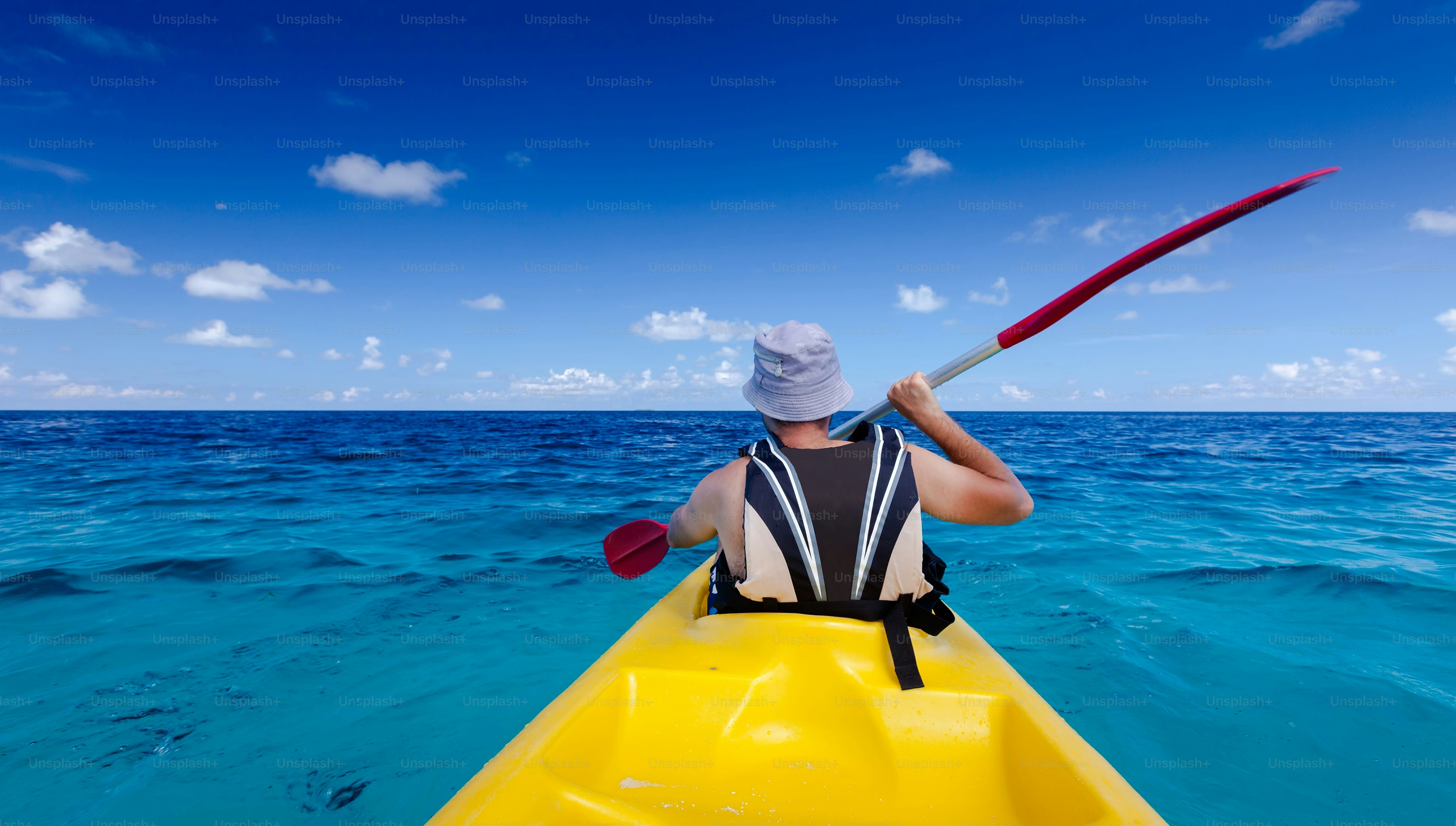 Caucasian man kayaking in sea at Maldives photo – Travel Image on Unsplash