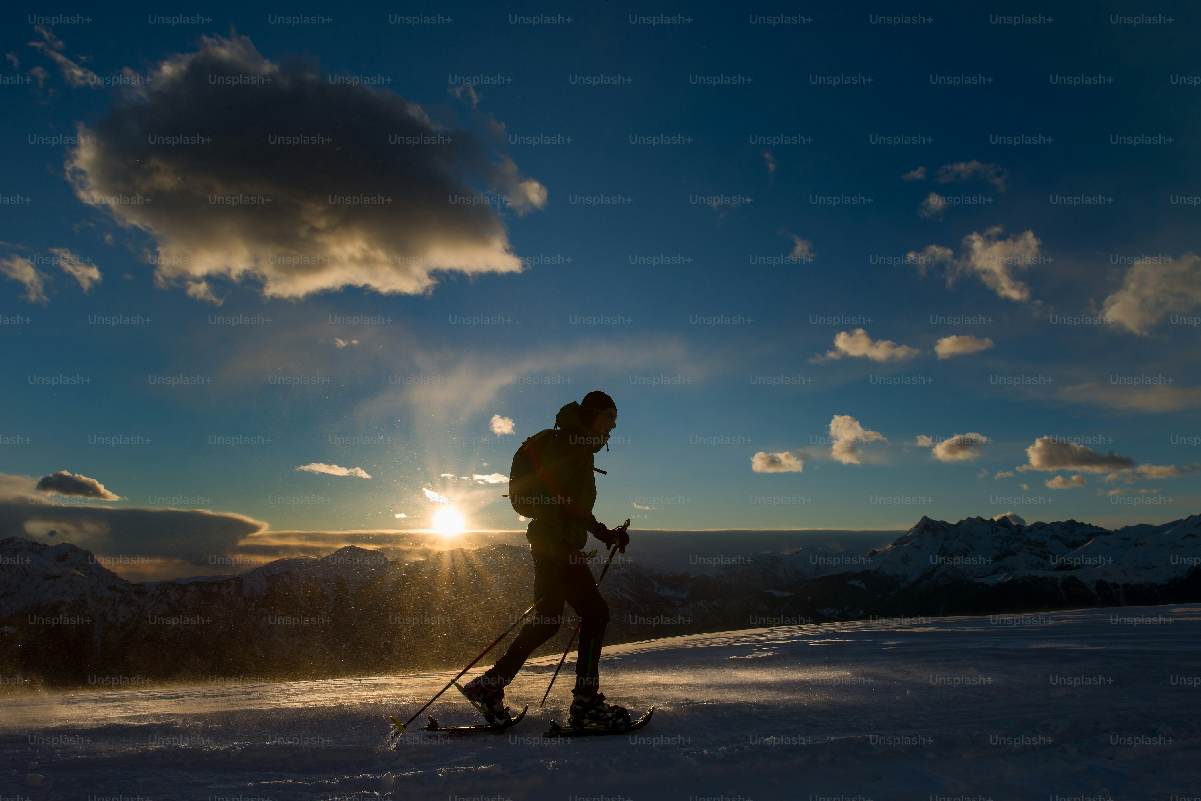 A fantastic cloudy sunset with a walker closeup. photo – Mountaineer ...