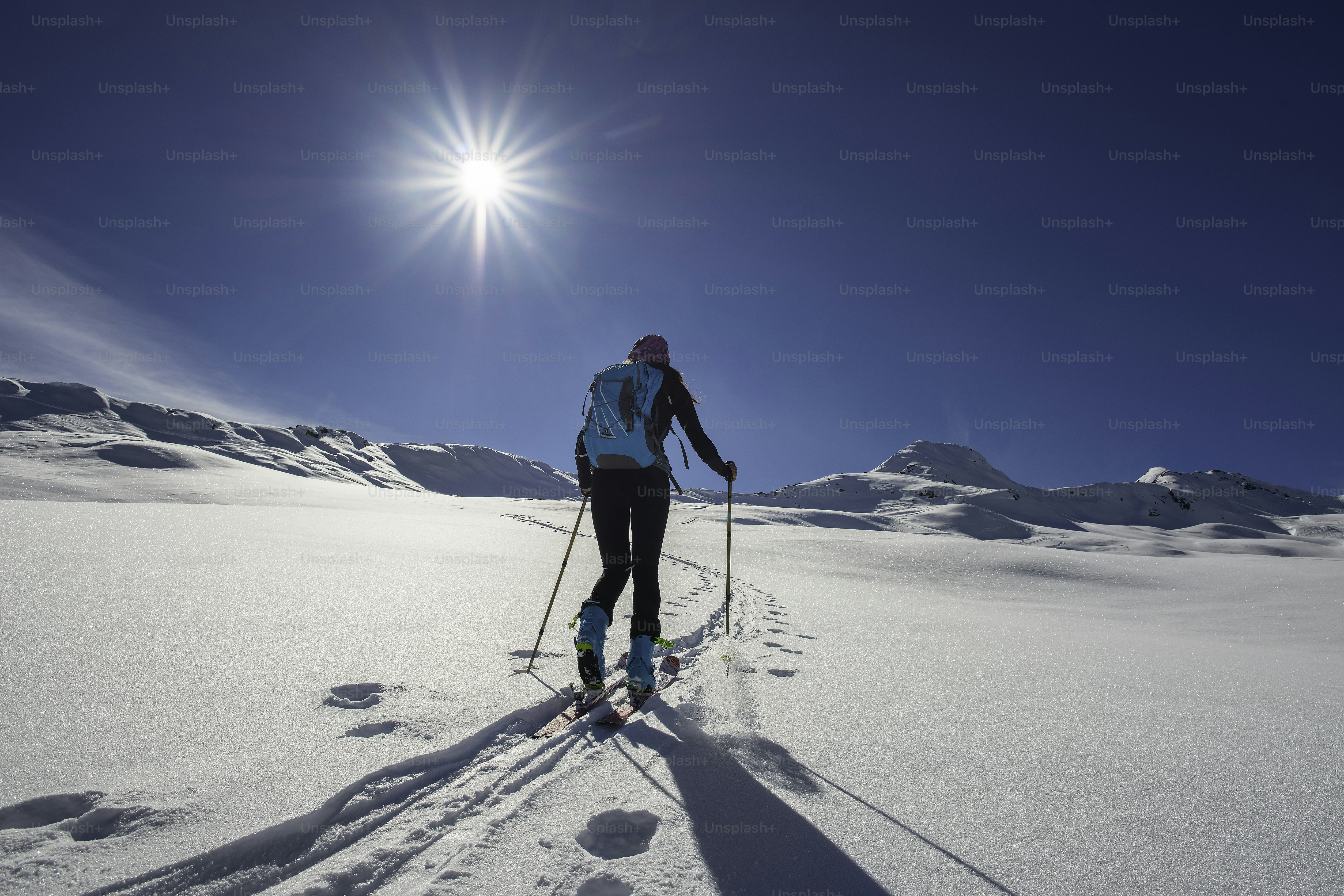 Uphill girl with seal skins and ski mountaineering in the alps photo ...