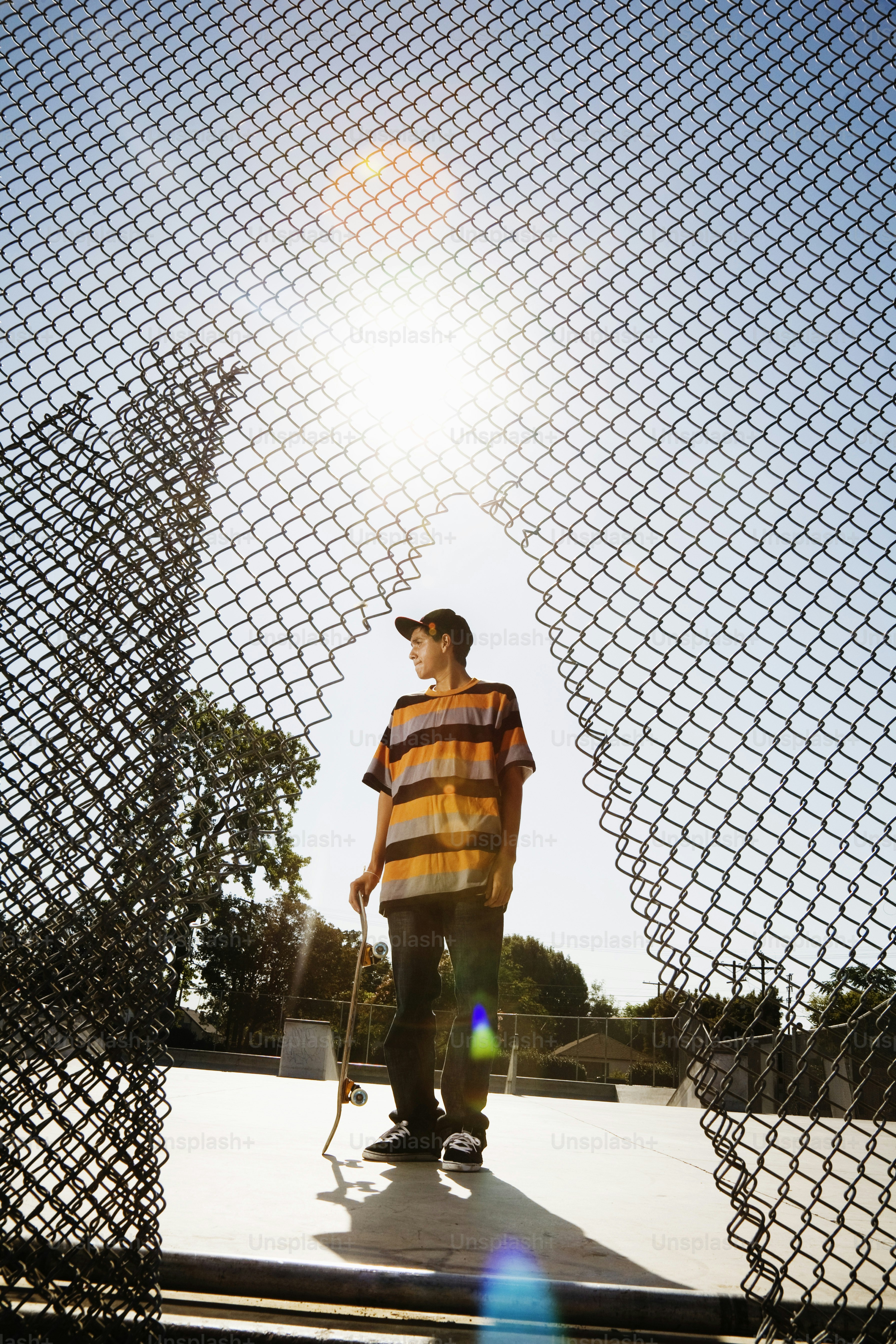 A man standing on a ramp with a skateboard photo – Photography Image on ...