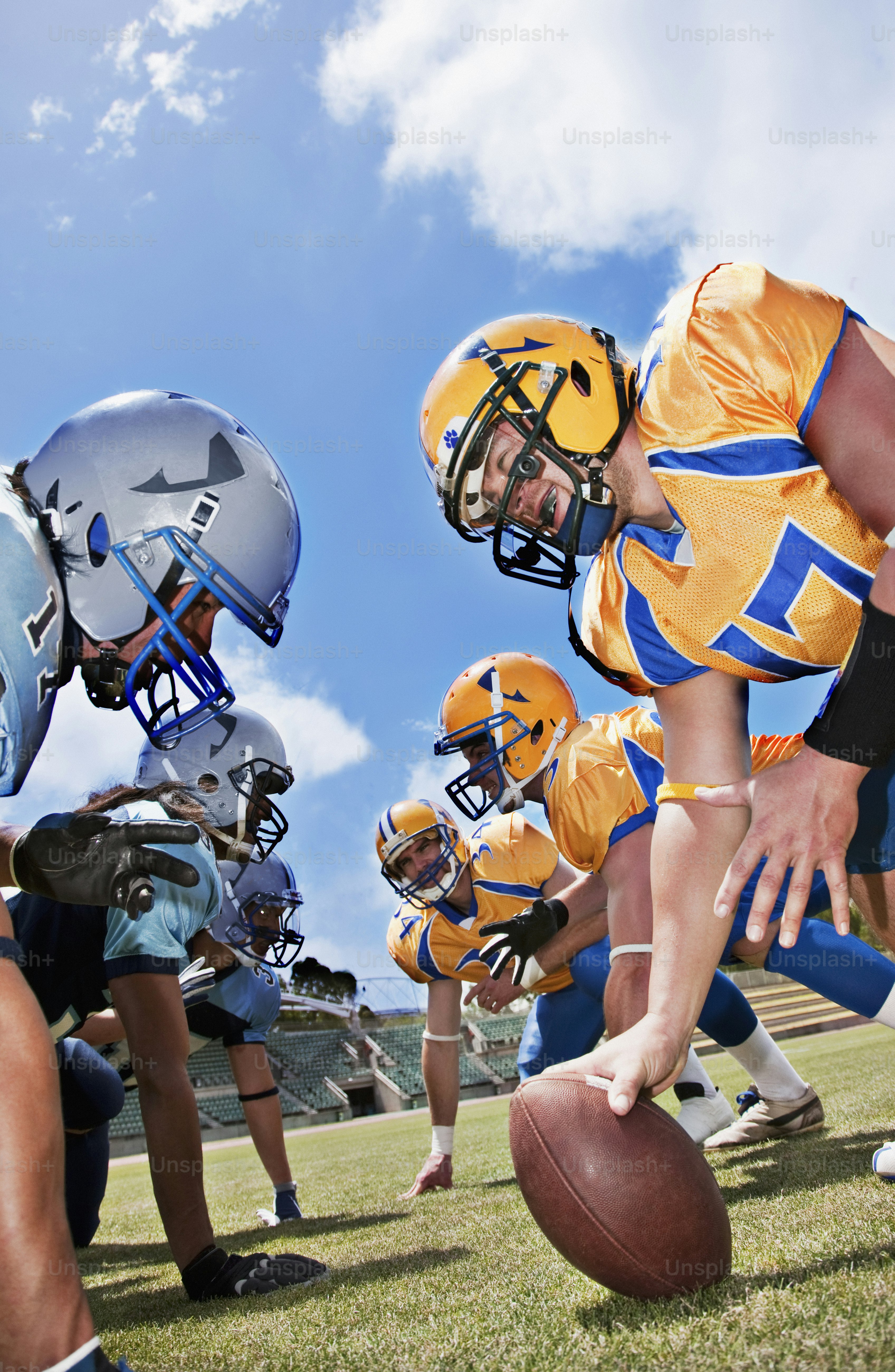 A group of young men playing a game of football photo – Confrontation ...