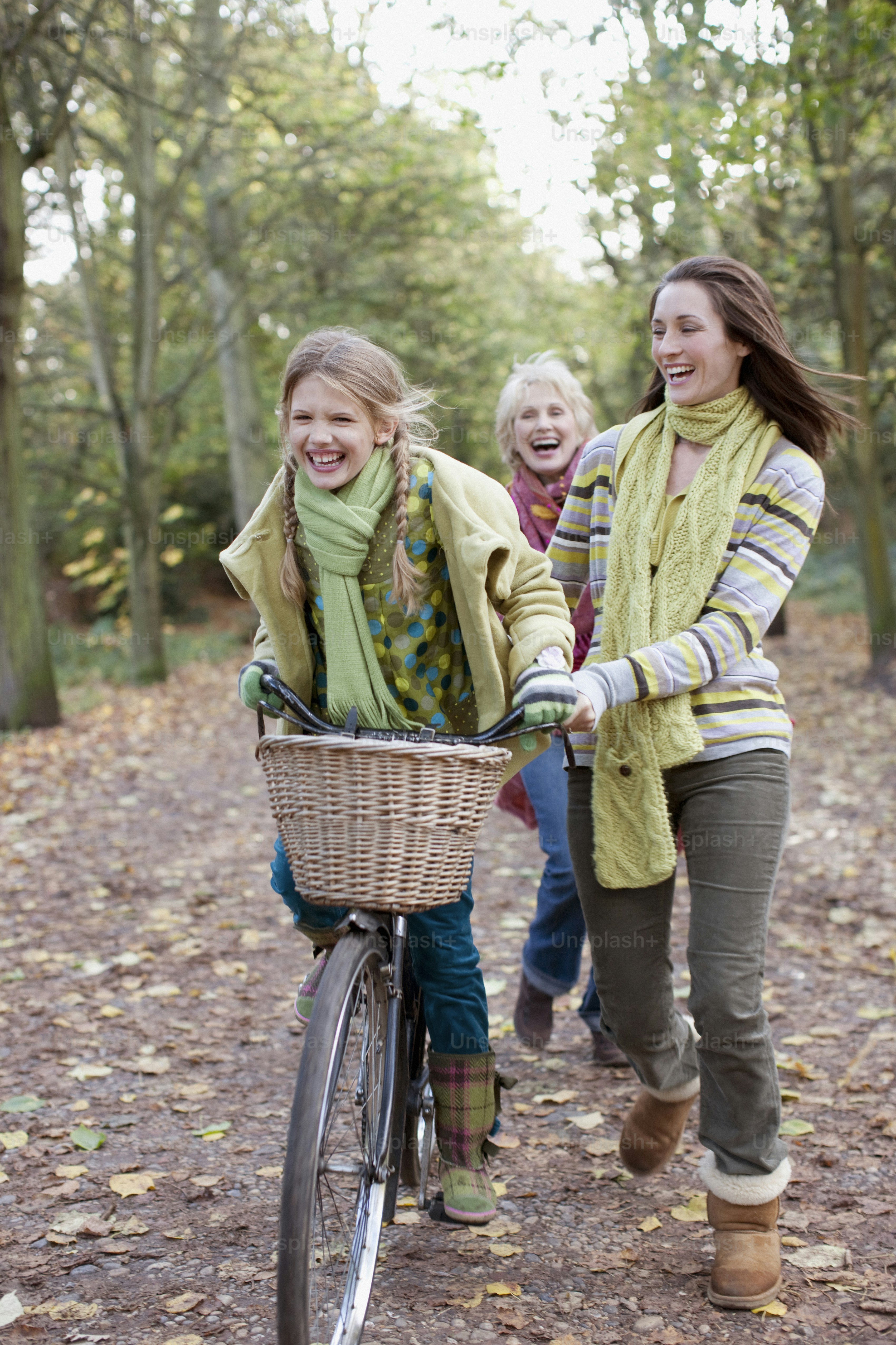 Three girls riding a bike in the woods photo – Riding Image on Unsplash