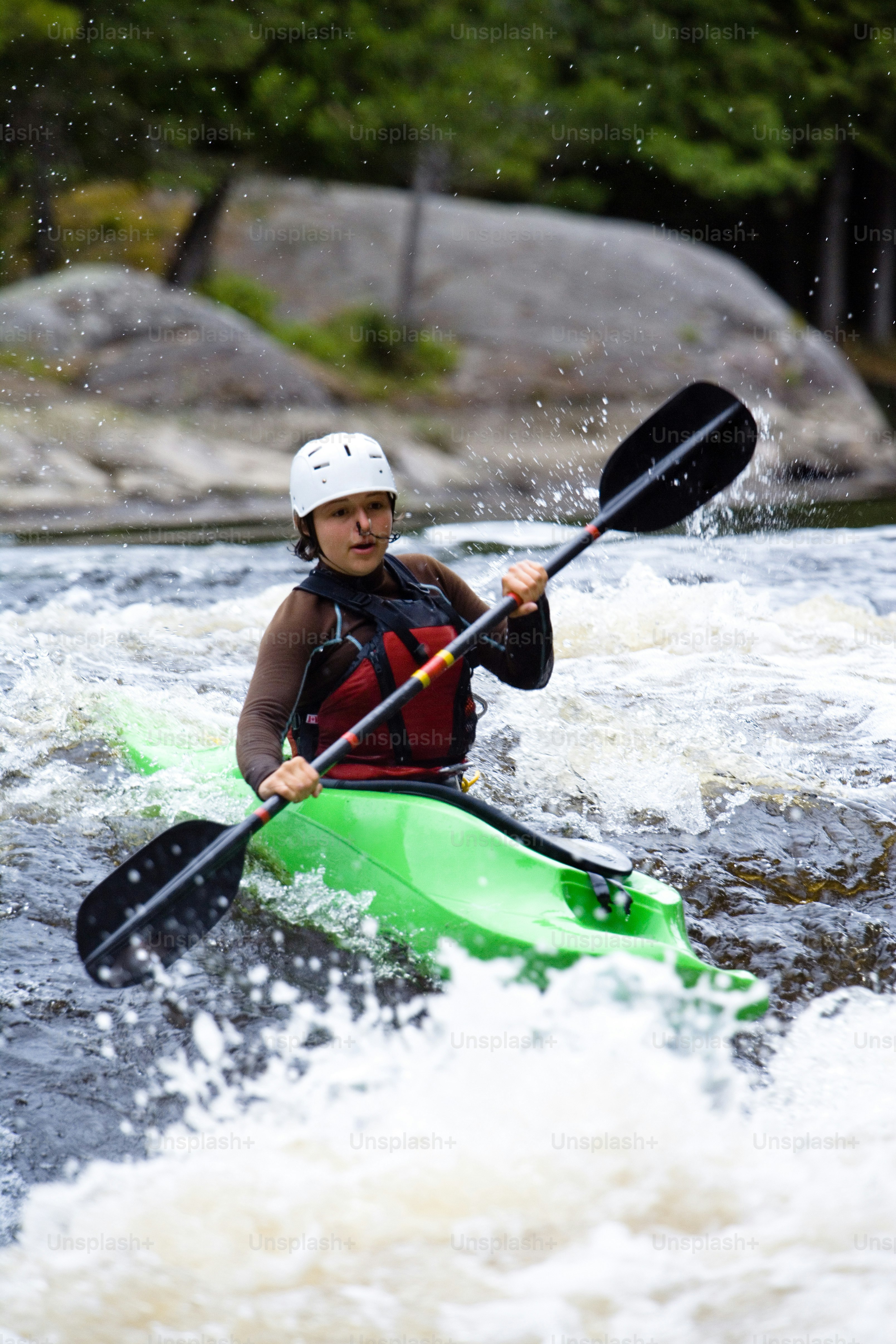A person in a kayak paddling down a river photo – Kayak Image on Unsplash