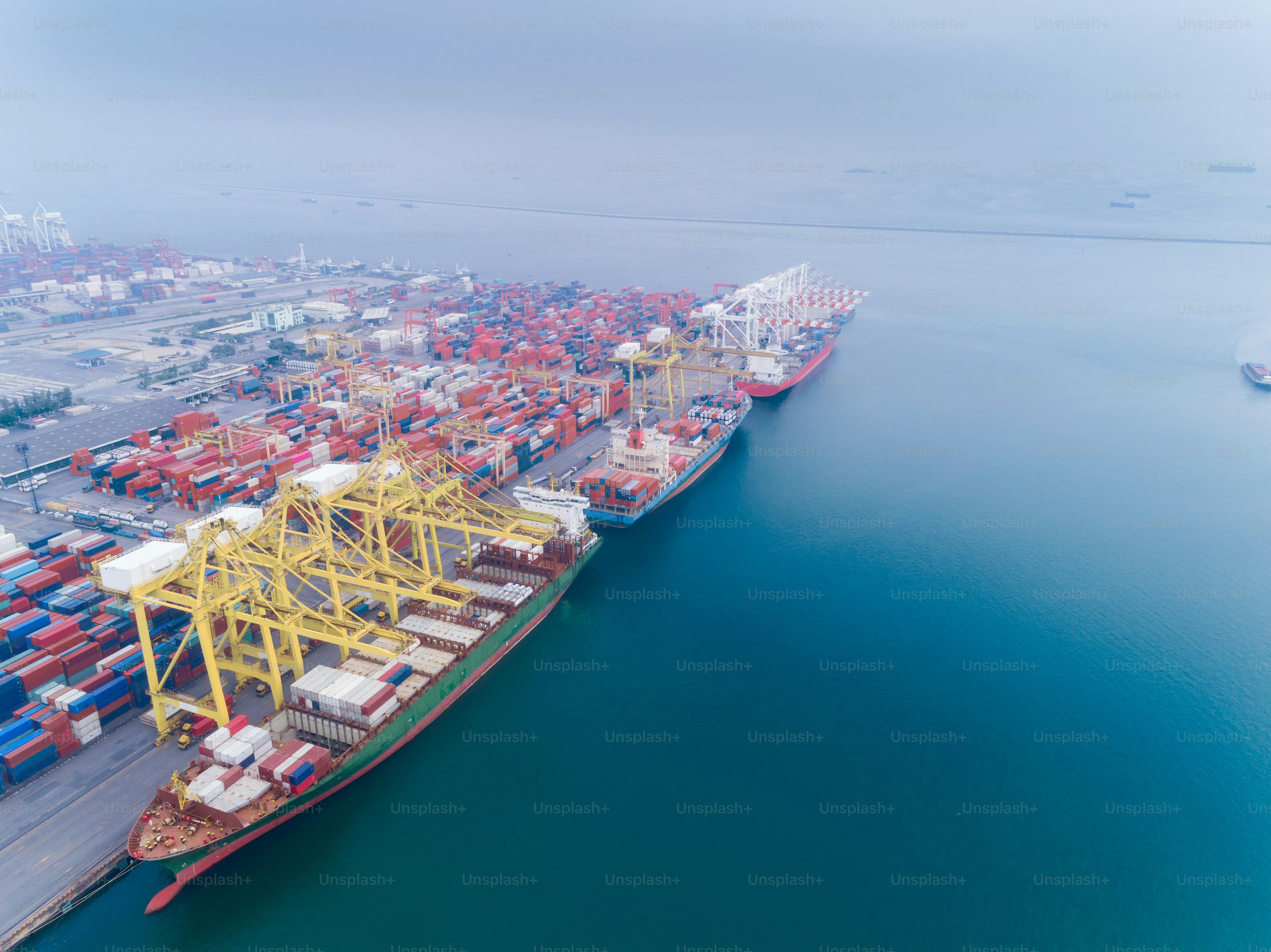 Aerial view container ship and container warehouse from sea port for ...