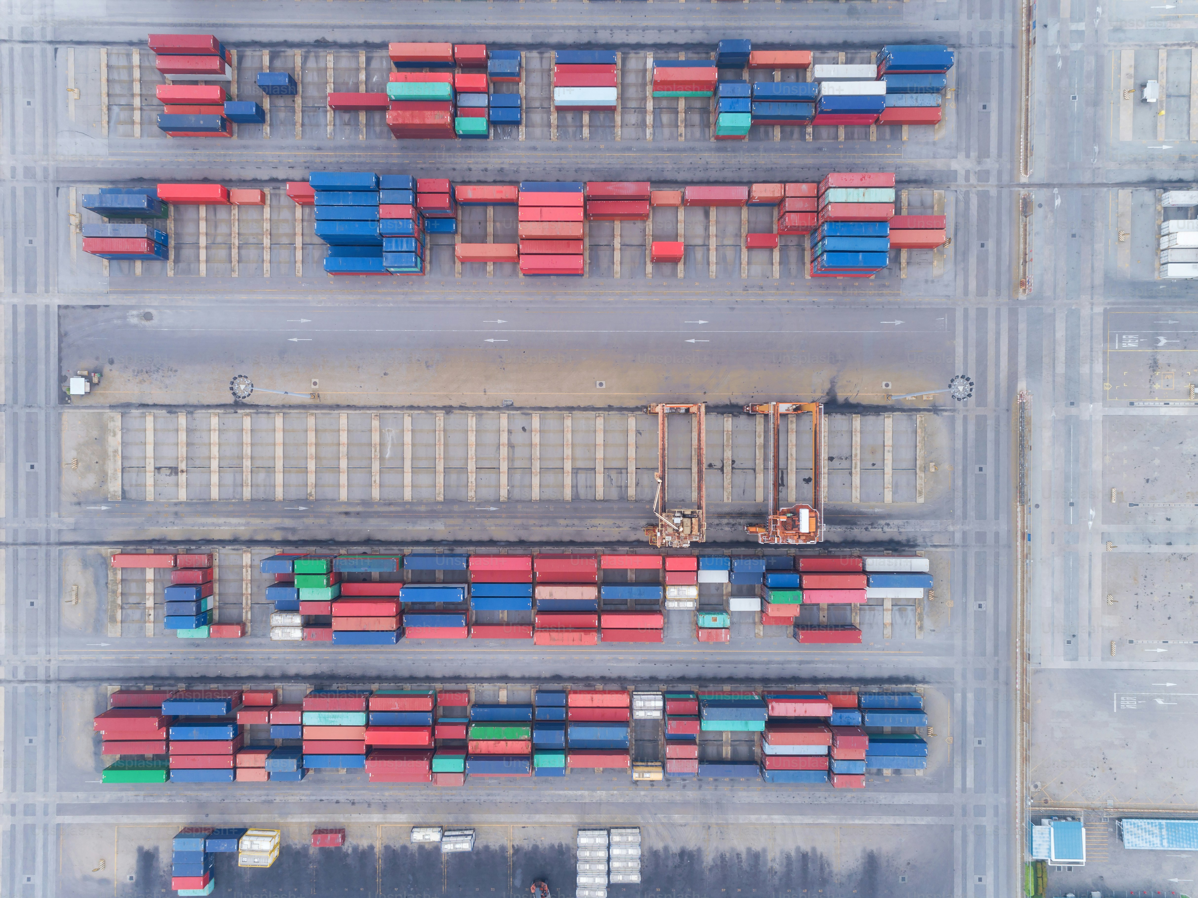 Aerial view sea port warehouse and container ship or crane ship working ...