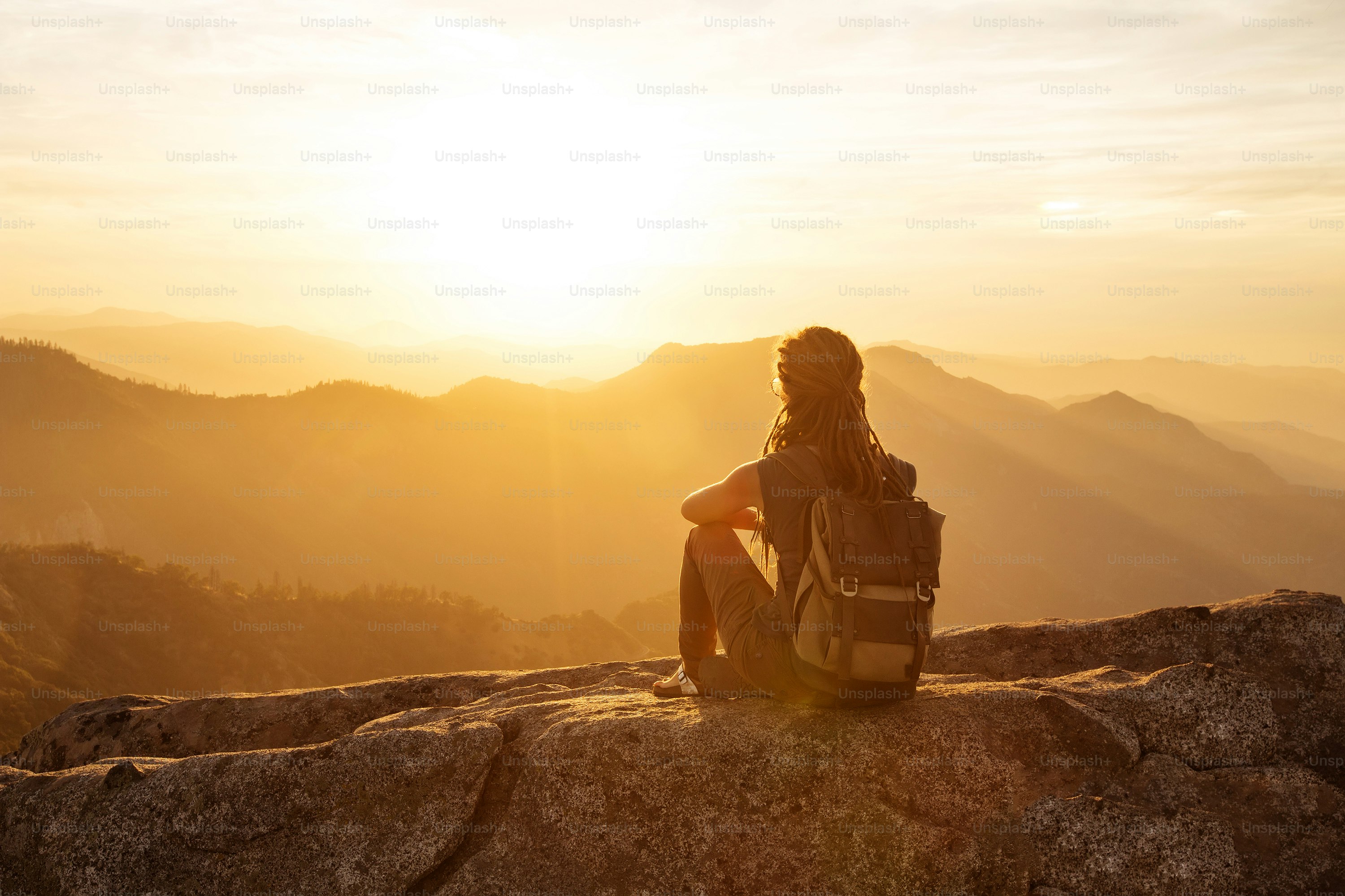 Hiker meets the sunset on the Moro rock in Sequoia national park, California, USA. photo ...
