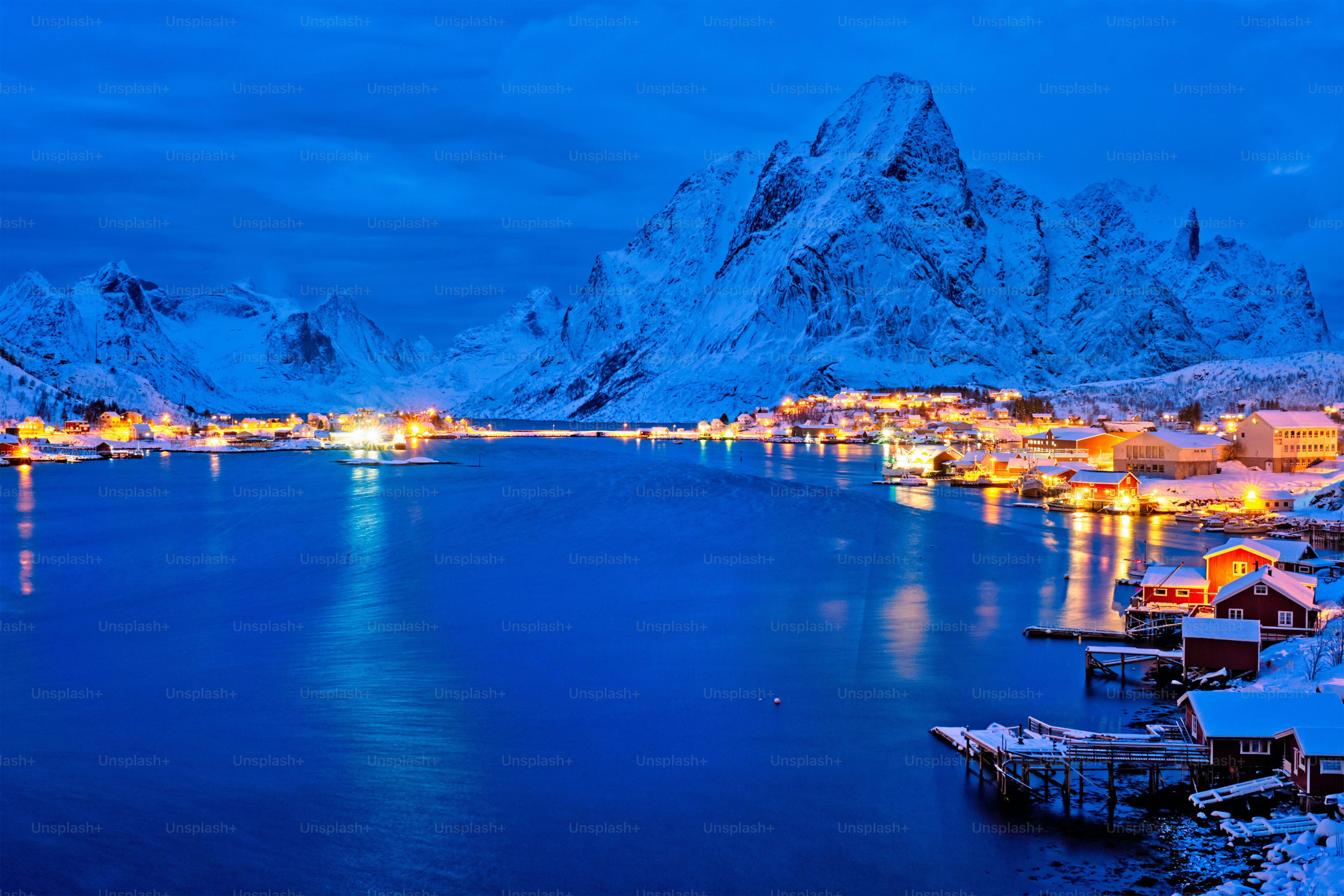Reine village illuminated at night with Aurora Borealis. Lofoten ...