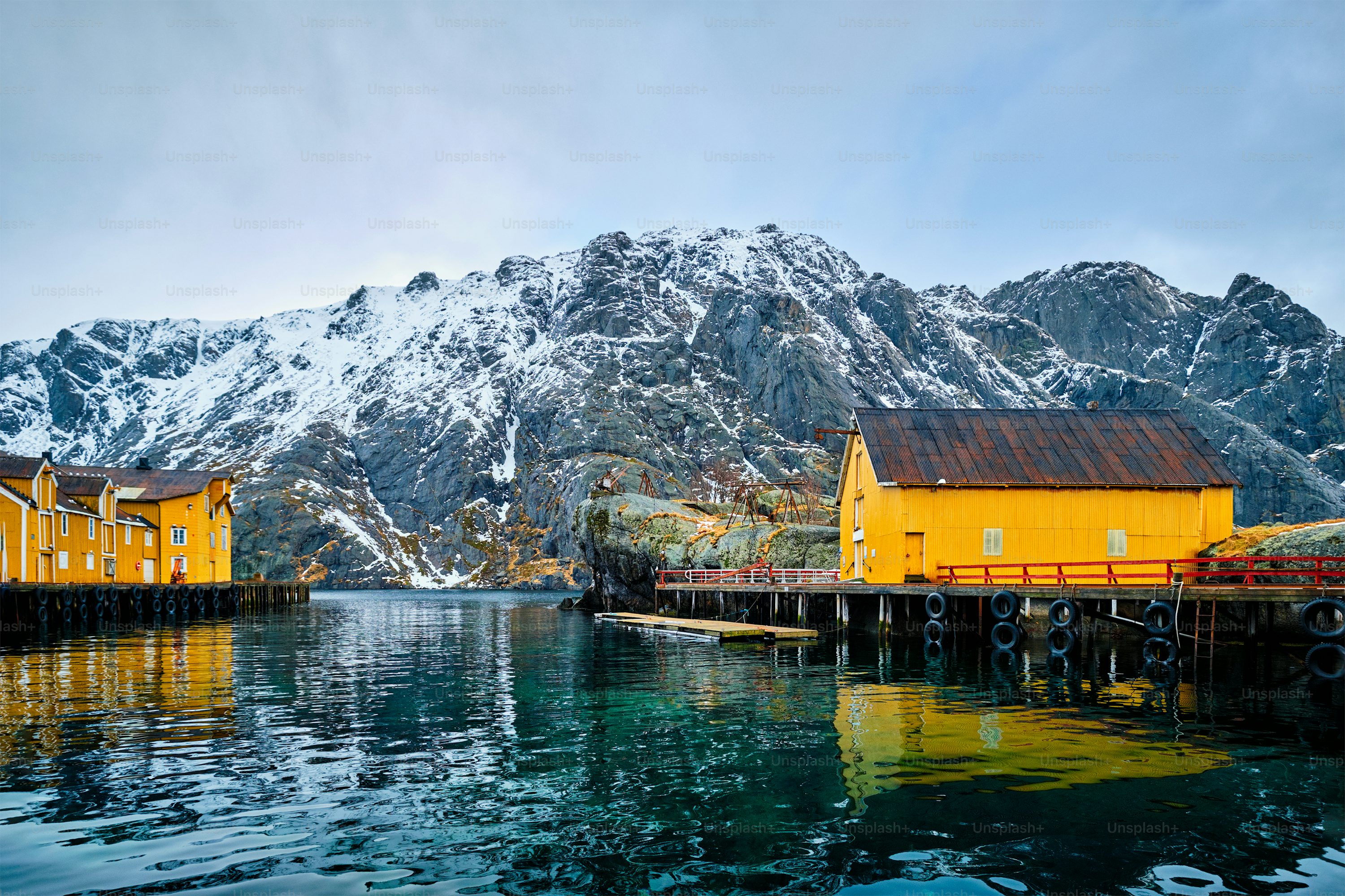 Nusfjord authentic fishing village with traditional red rorbu houses in ... Nusfjord authentic fishing village with traditional red rorbu houses in ...