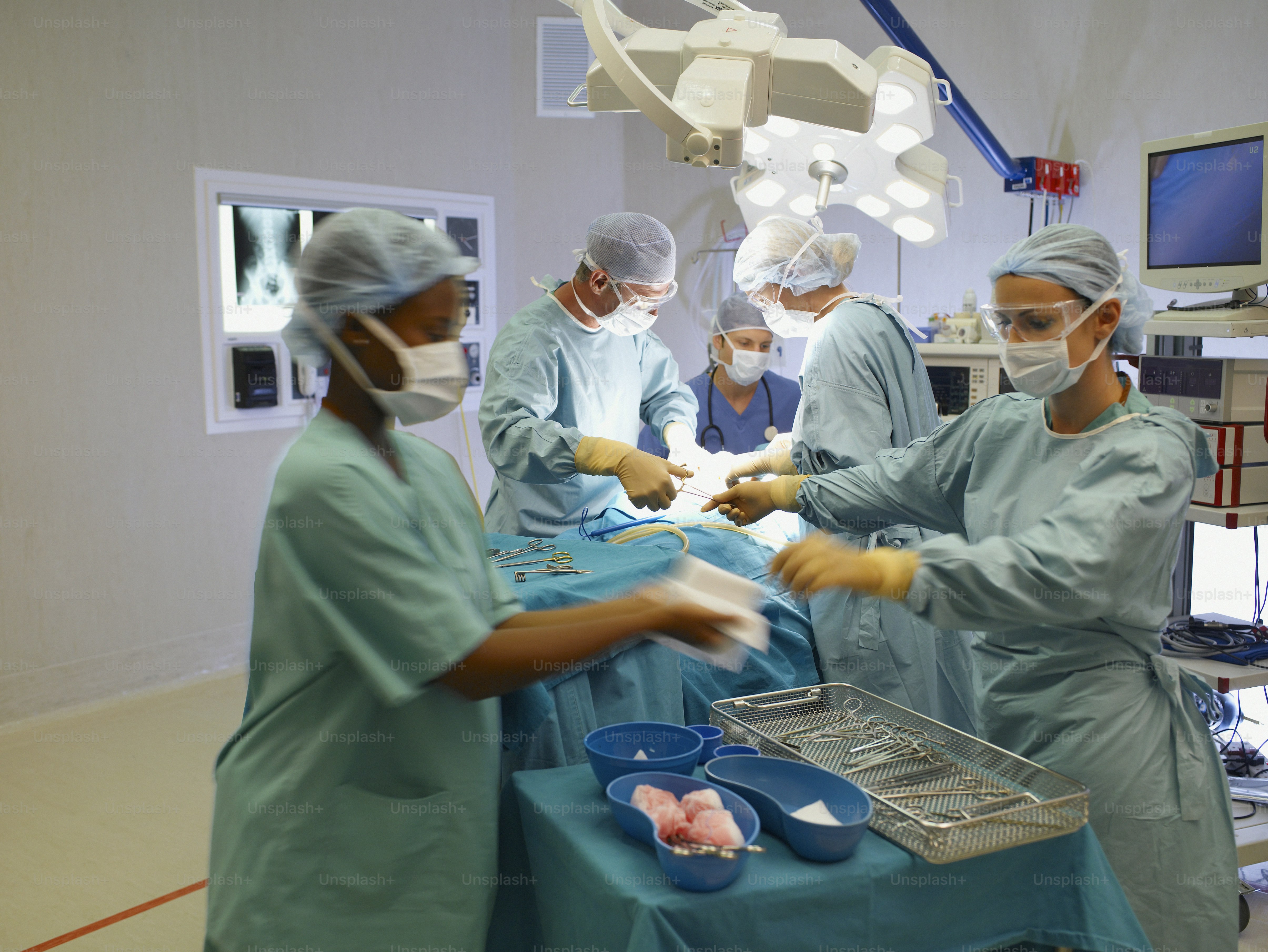A group of doctors in scrubs preparing food photo – Day Image on Unsplash