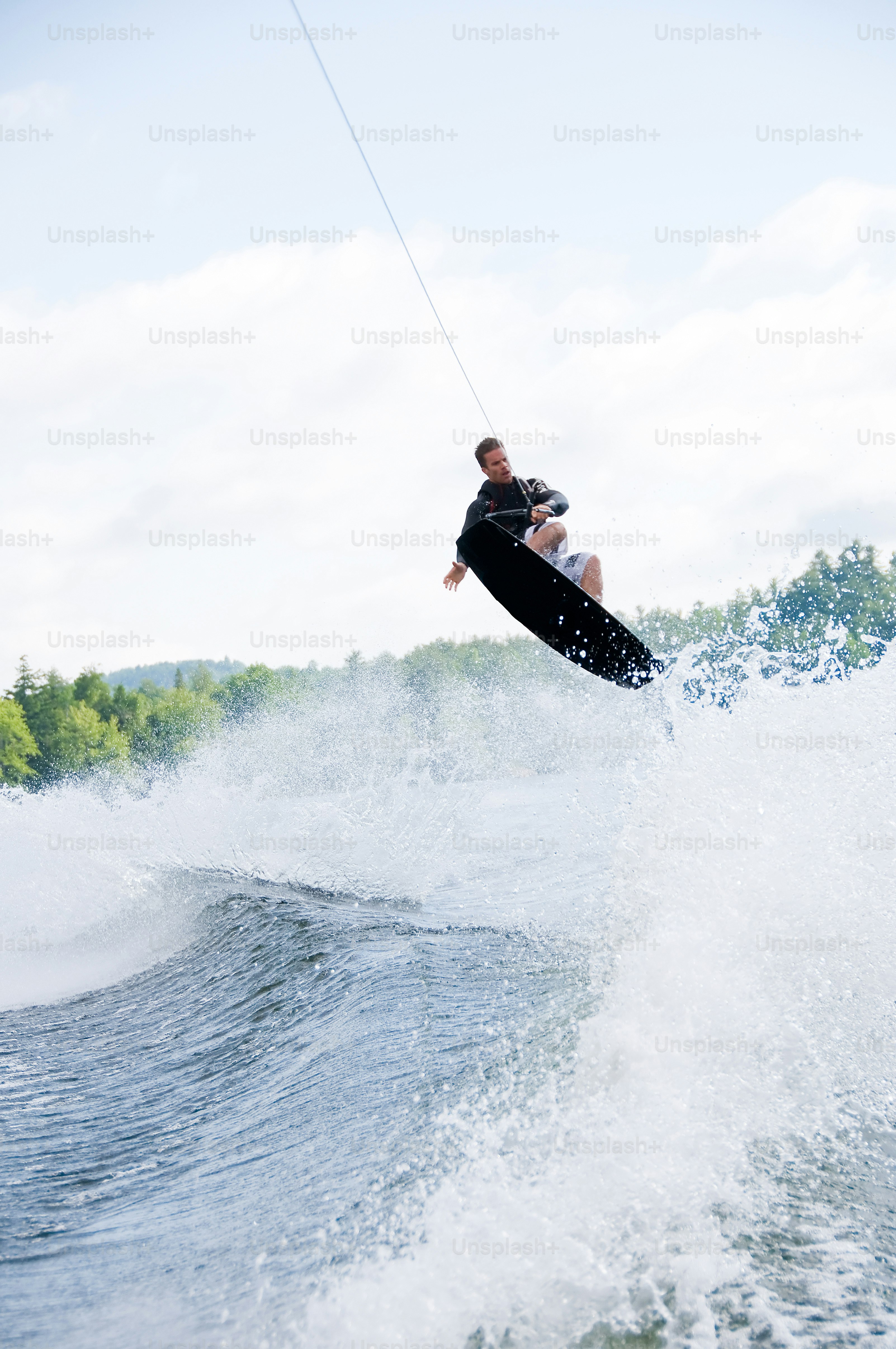 A man riding a wave on top of a surfboard photo – Outdoors Image on ...
