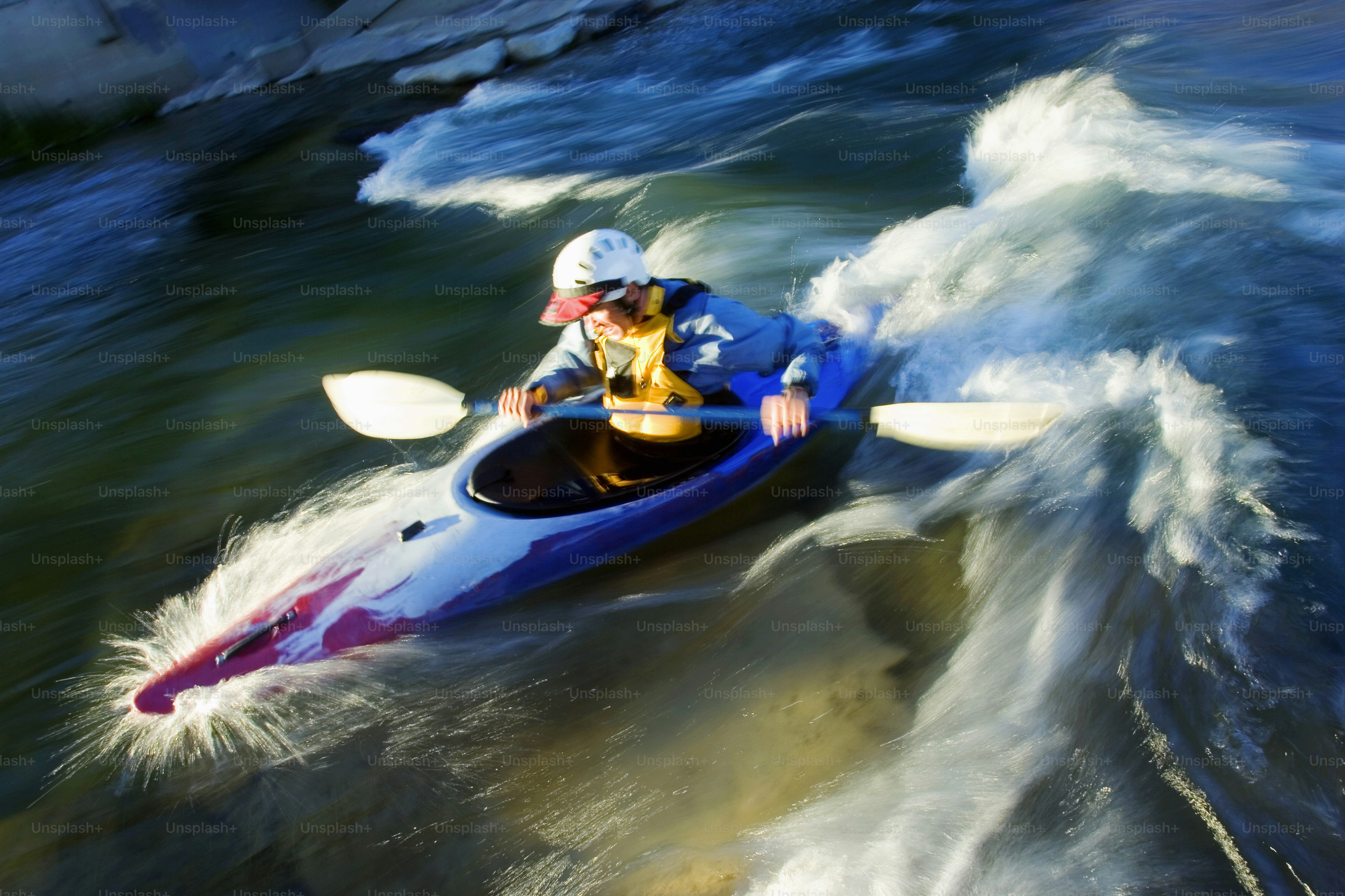 A man riding a kayak on top of a river photo – White water Image on ...