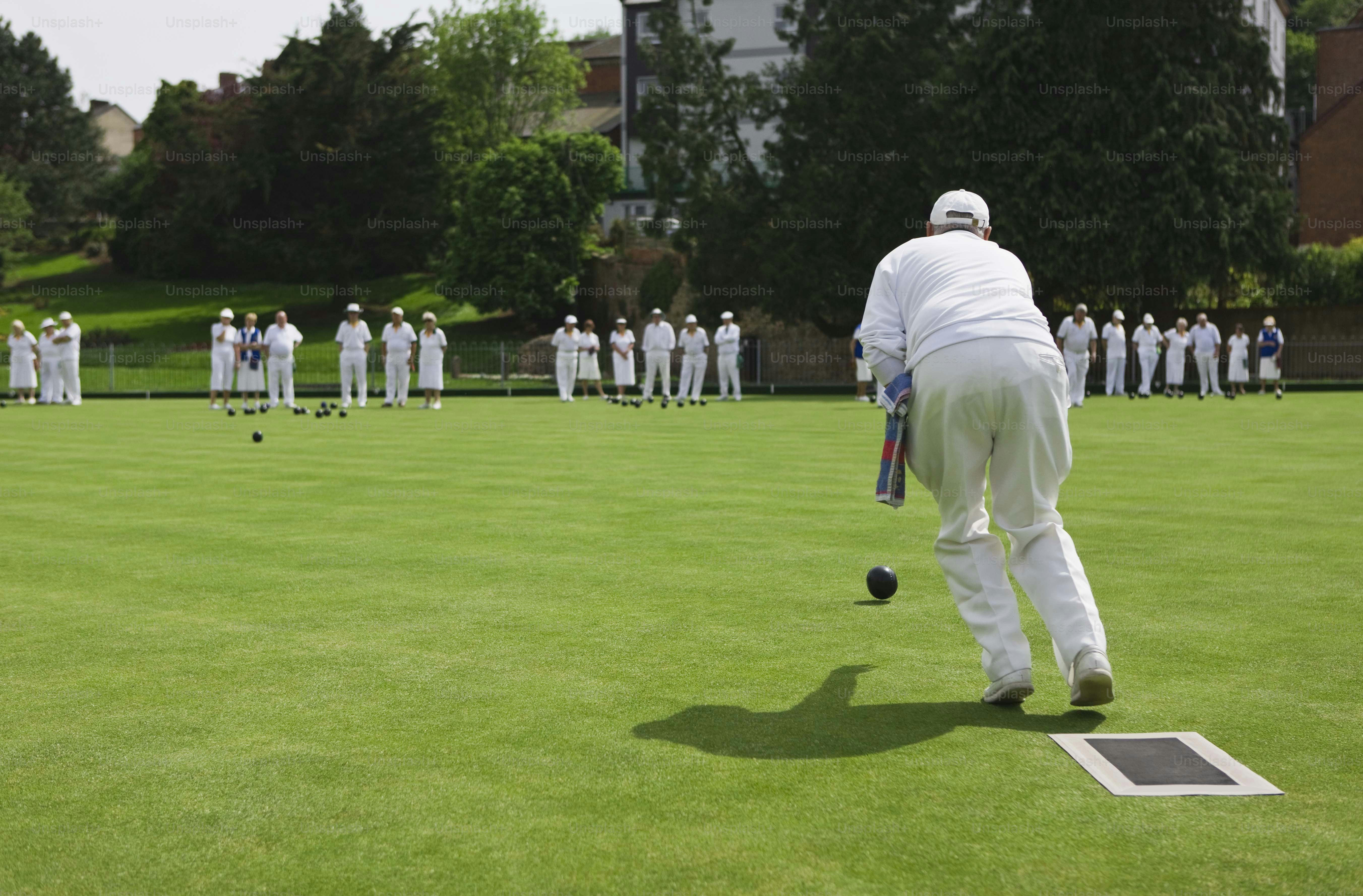 A group of men playing a game of croquet photo – Cricket Image on Unsplash