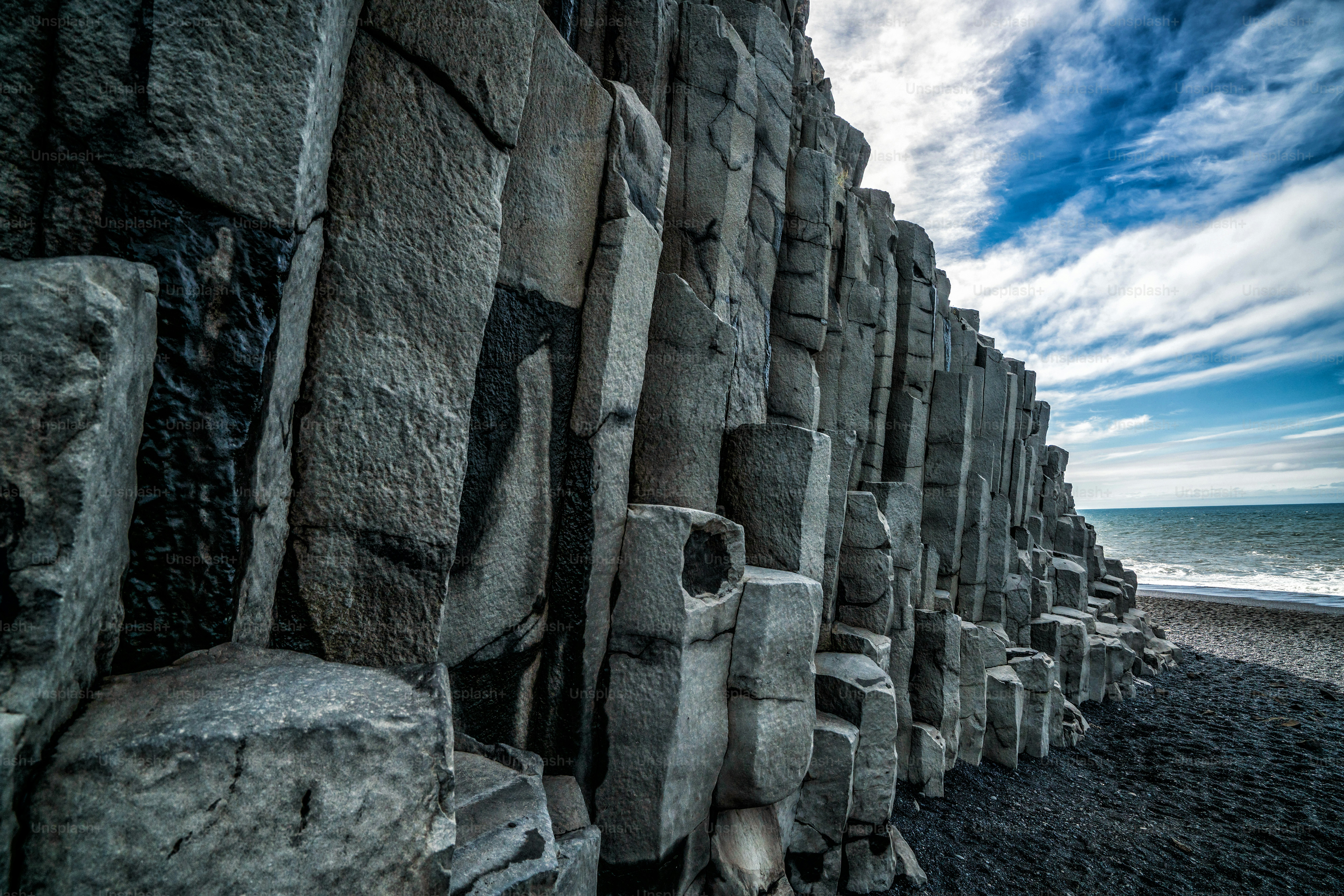 Beautiful and unique volcanic rock formation on Iceland black sand ...