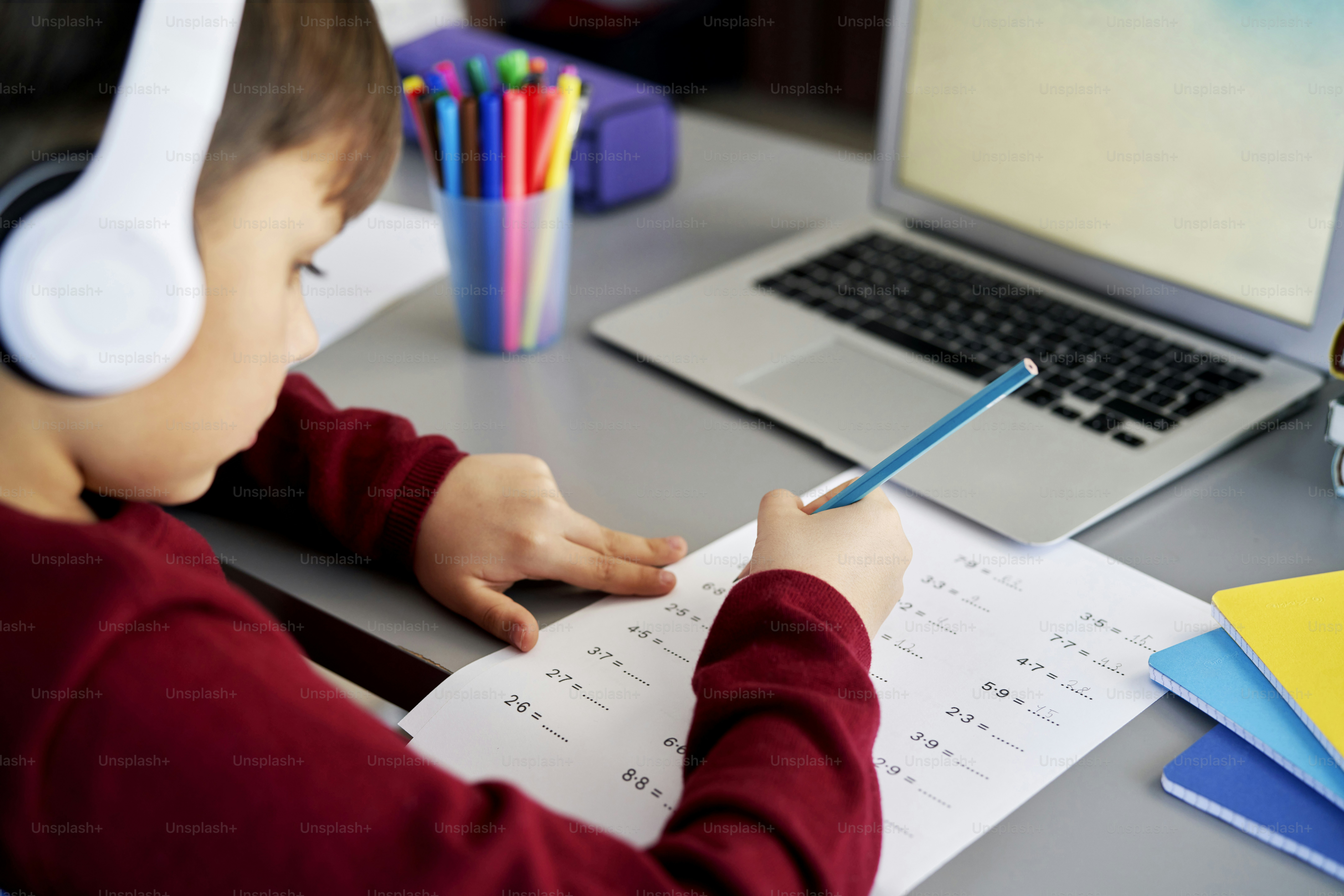 Close up of boy practicing a math equation photo – Paper Image on Unsplash