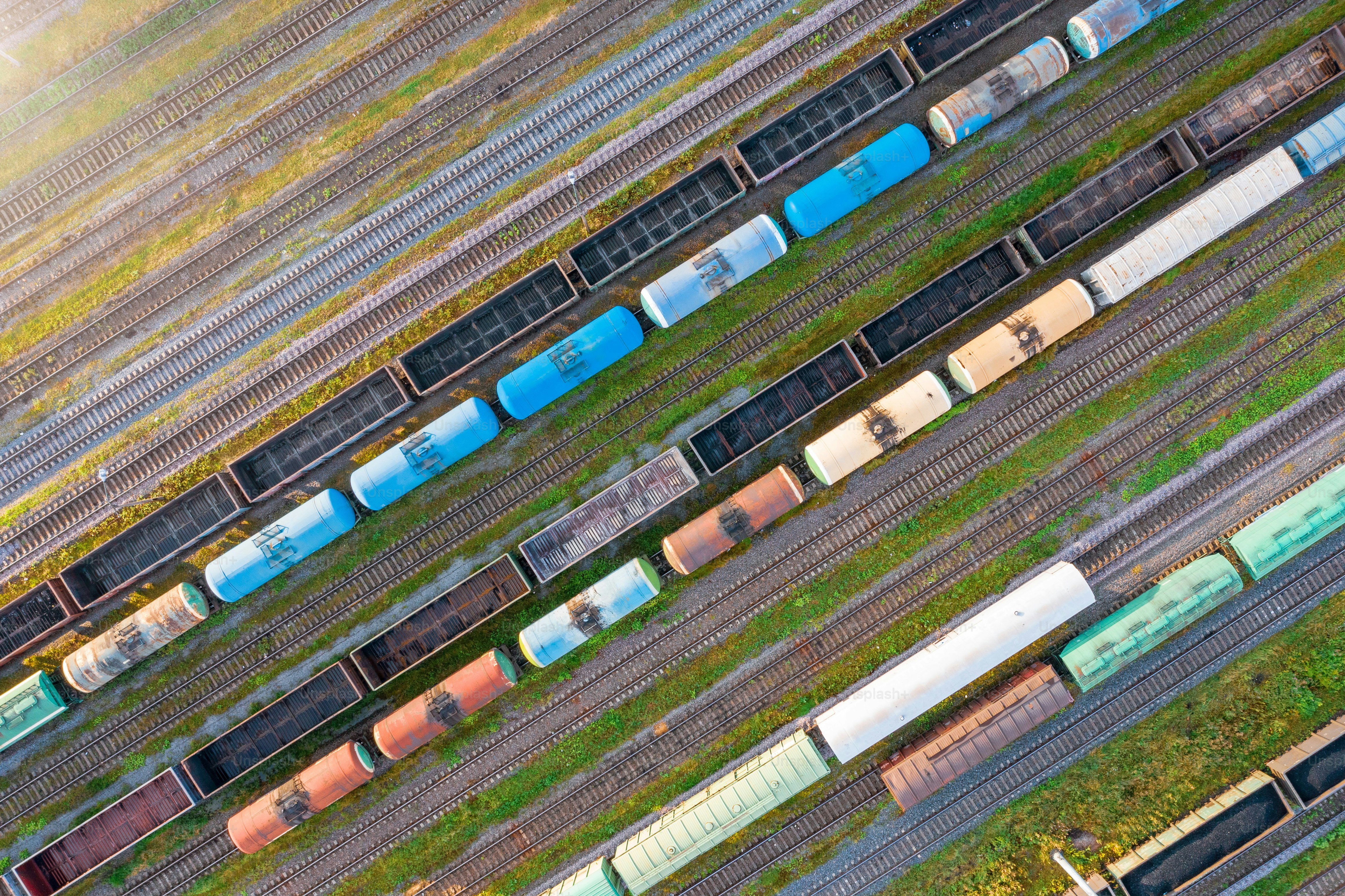 Aerial view of rail sorting freight station with various wagons, with ...