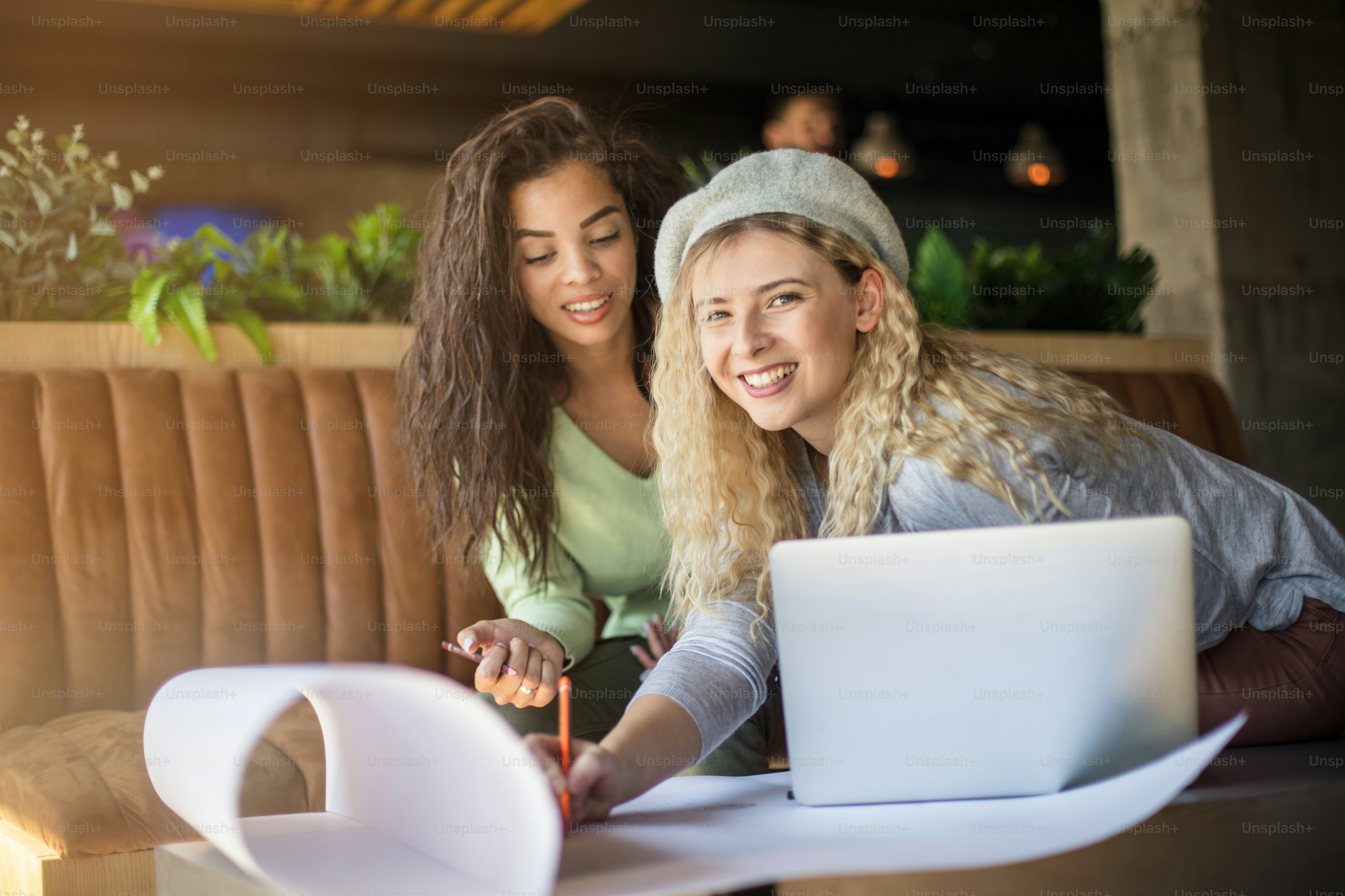 I will always help her. Two students girls learning together. photo ...