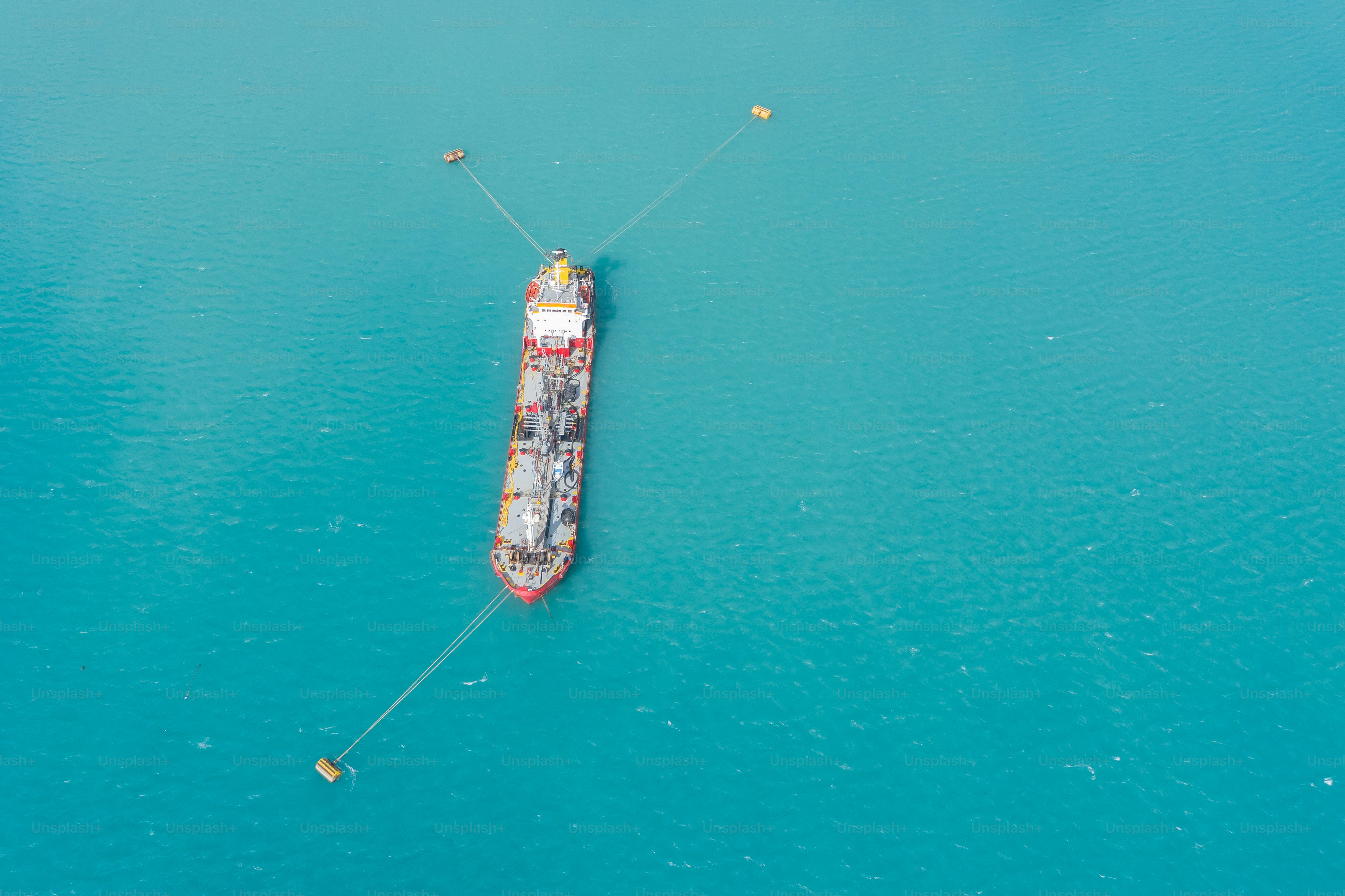 Aerial view of tanker fuel ship moored in a port bay to buoys photo ...