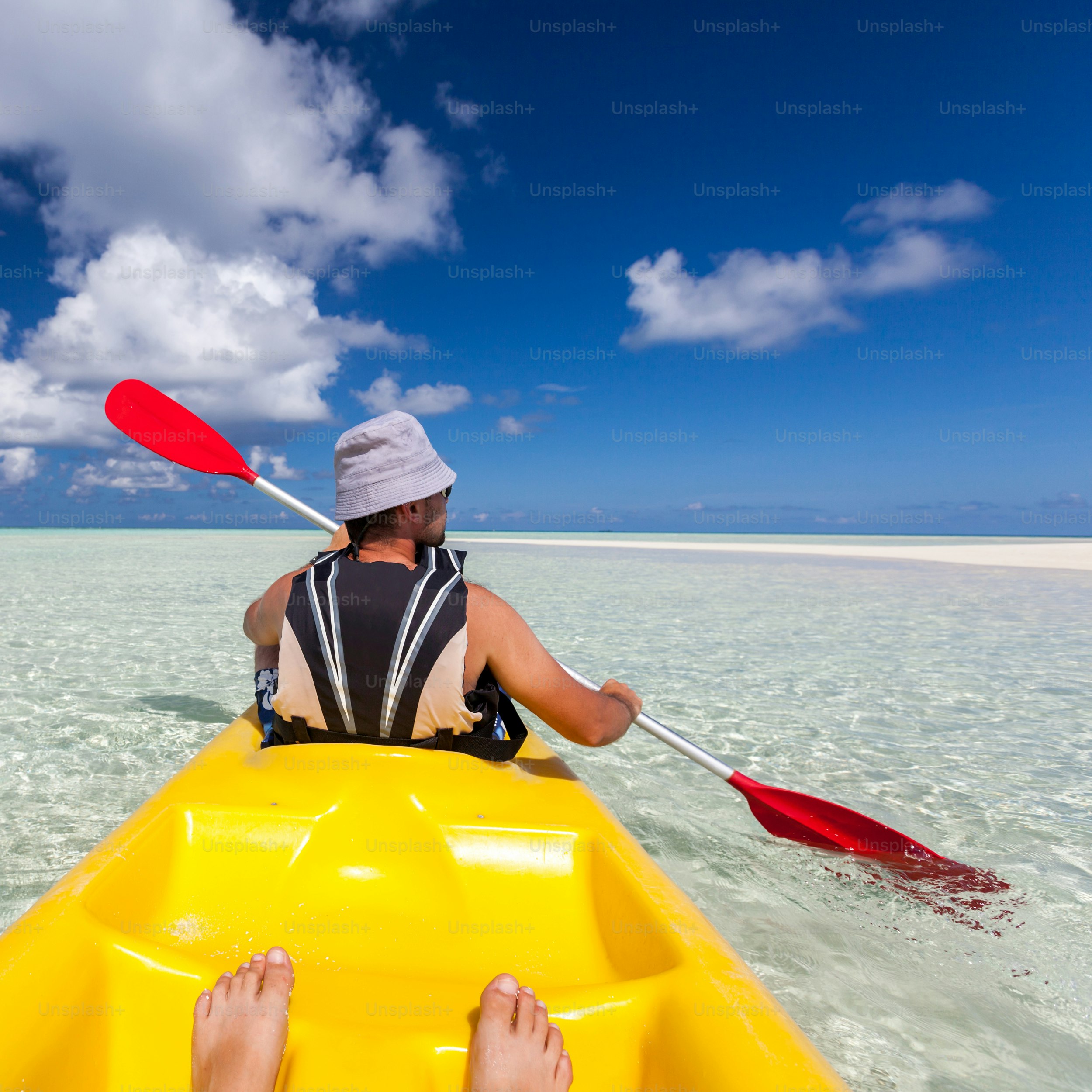 Young caucasian man kayaking in sea at Maldives photo – Kayaking Image ...