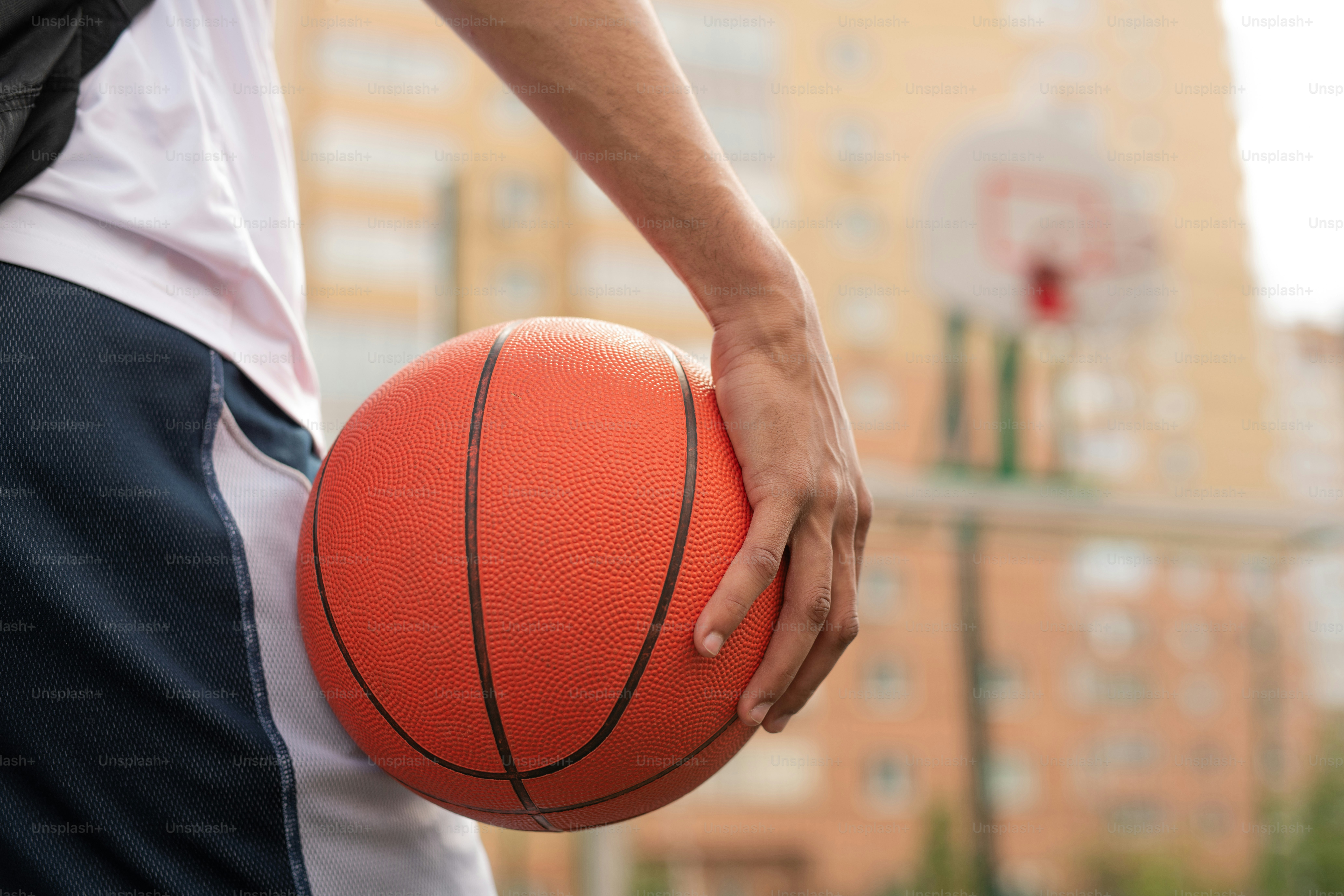 Hand Holding Basketball