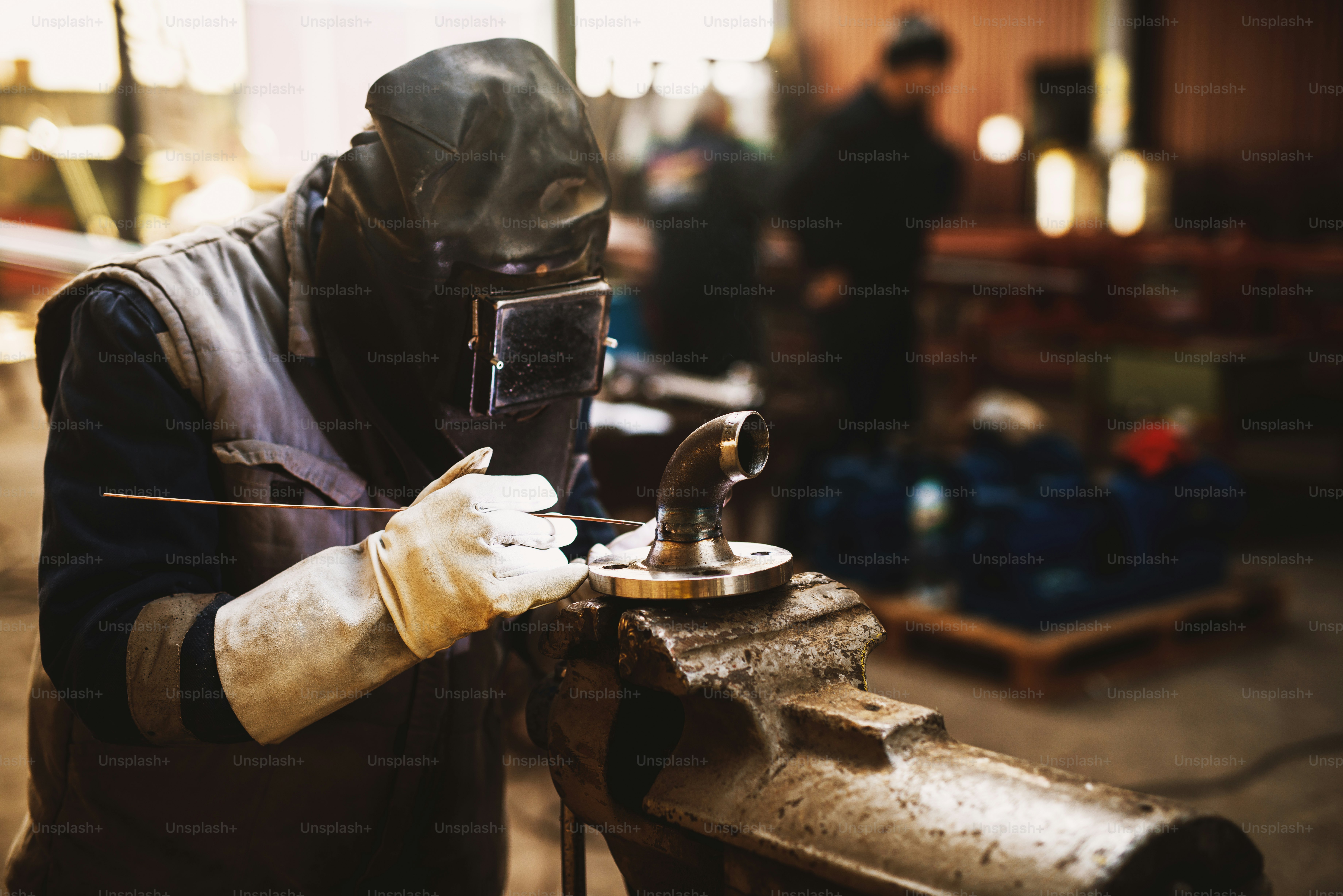 Close up portrait view of professional mask protected welder man in ...
