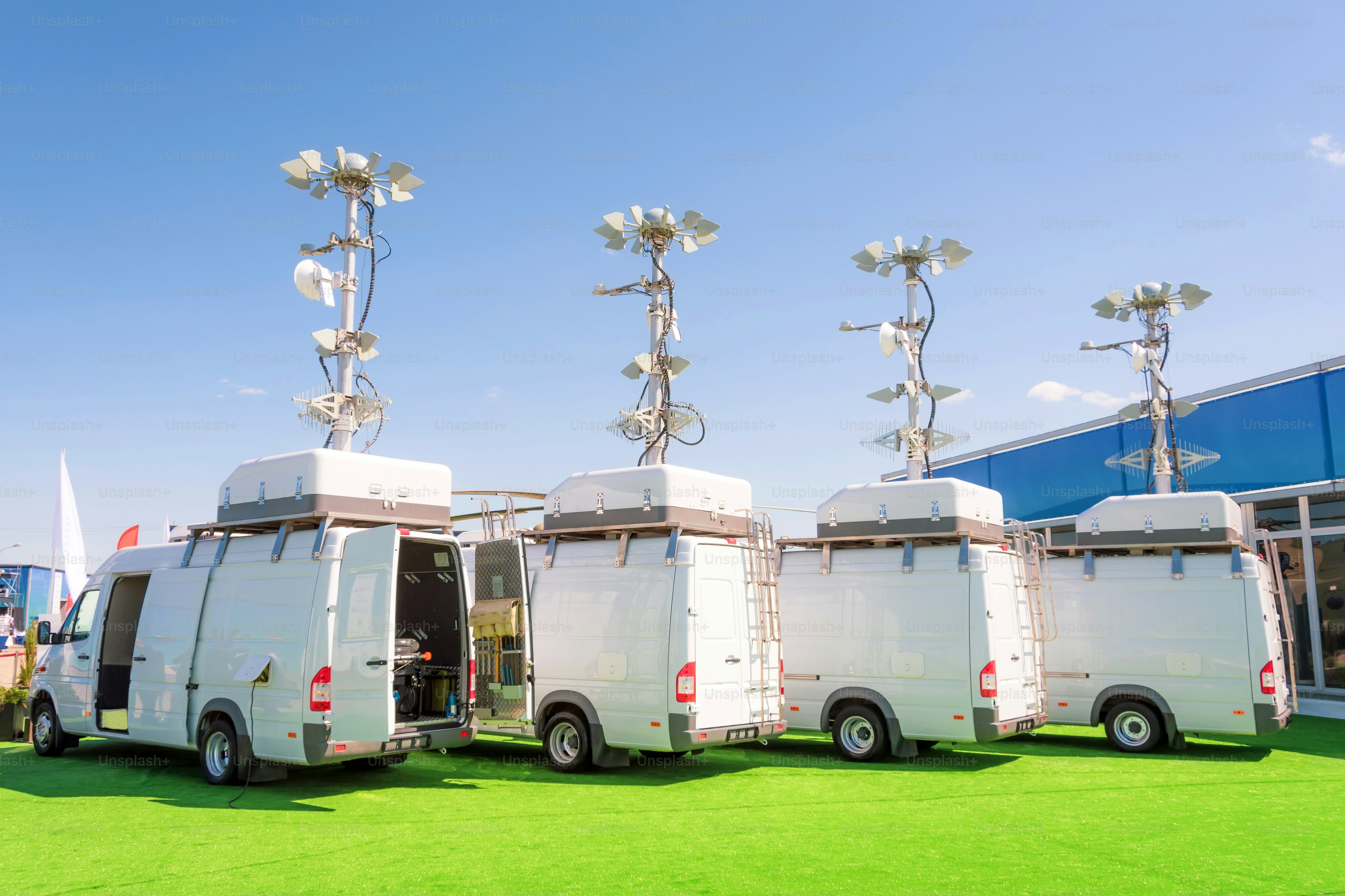 Powerful mobile antennas on the roofs of a van car for communication or ...