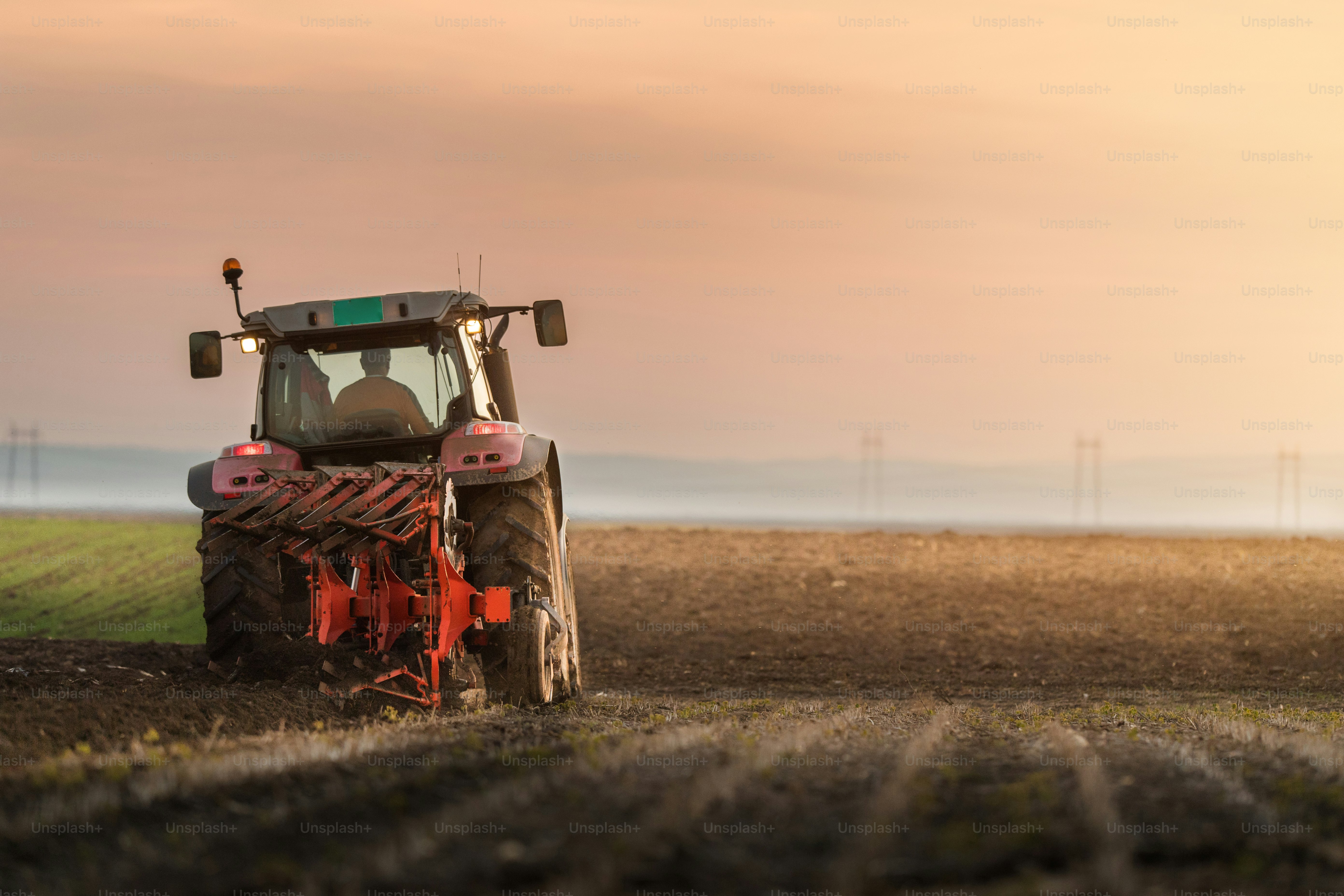 Tractor plowing fields -preparing land for sowing photo – Dirt Image on ...