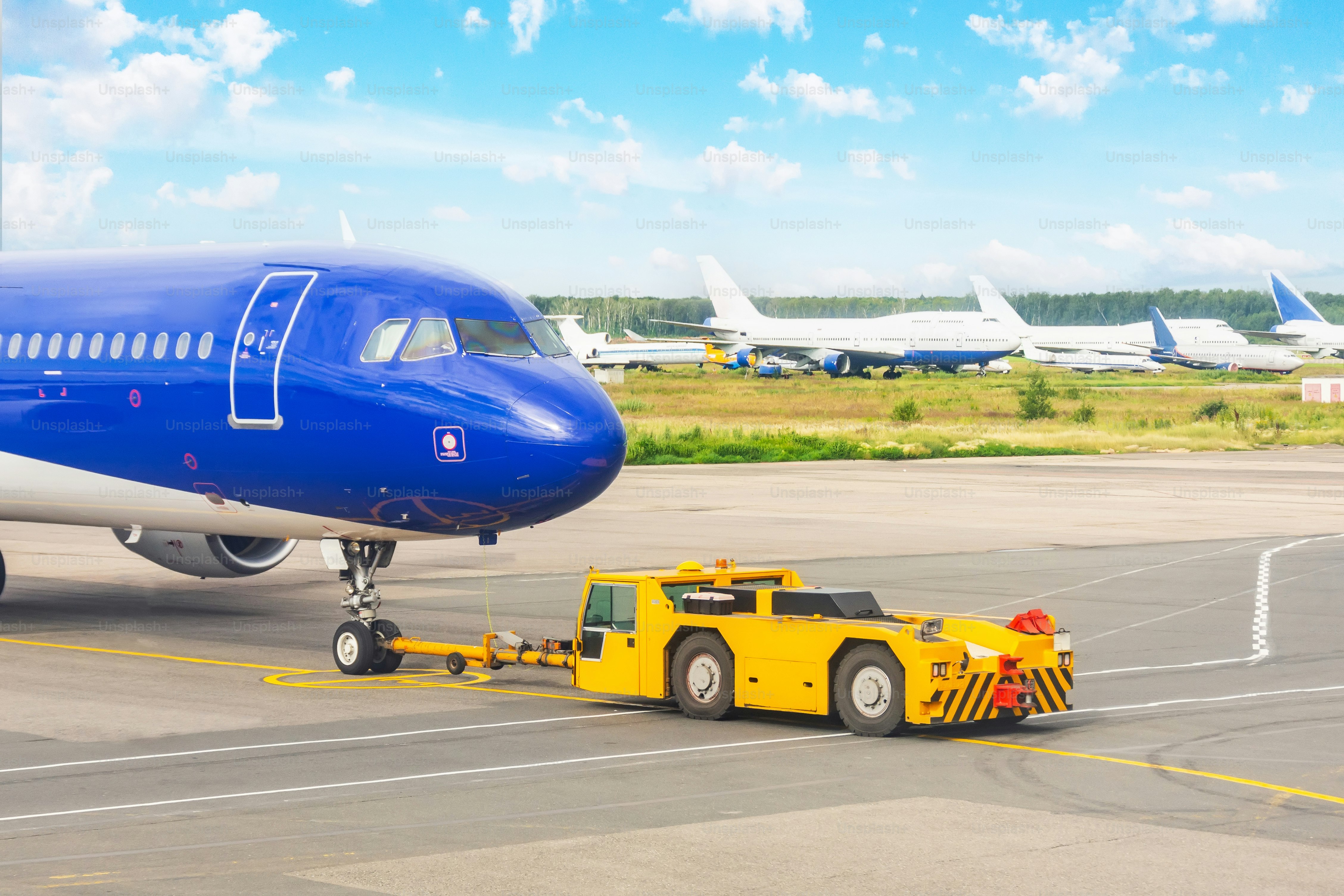 Performing towing and starting of aircraft engines, against the ...