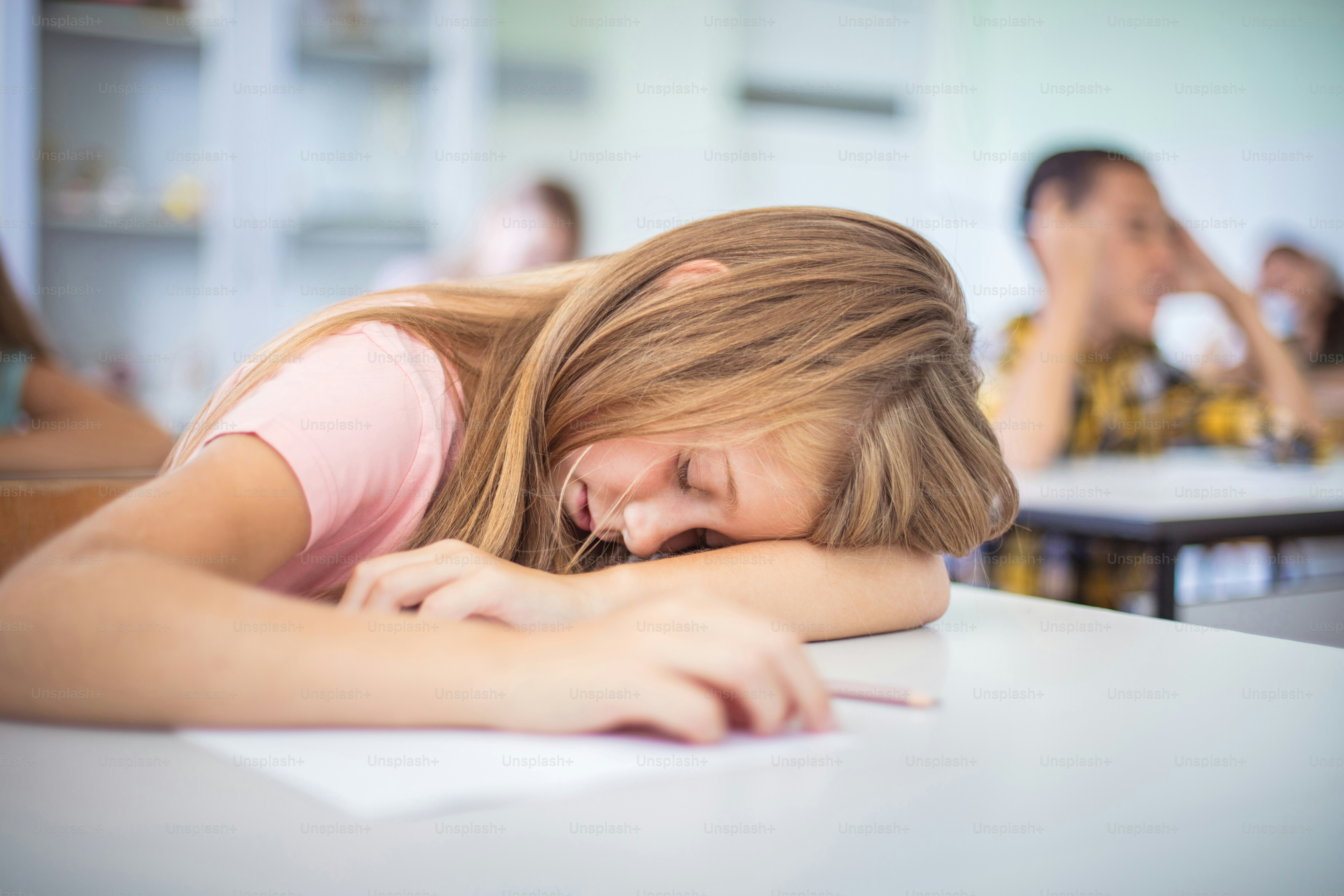 School girl sleeping on class. Teenagers students sitting in the ...