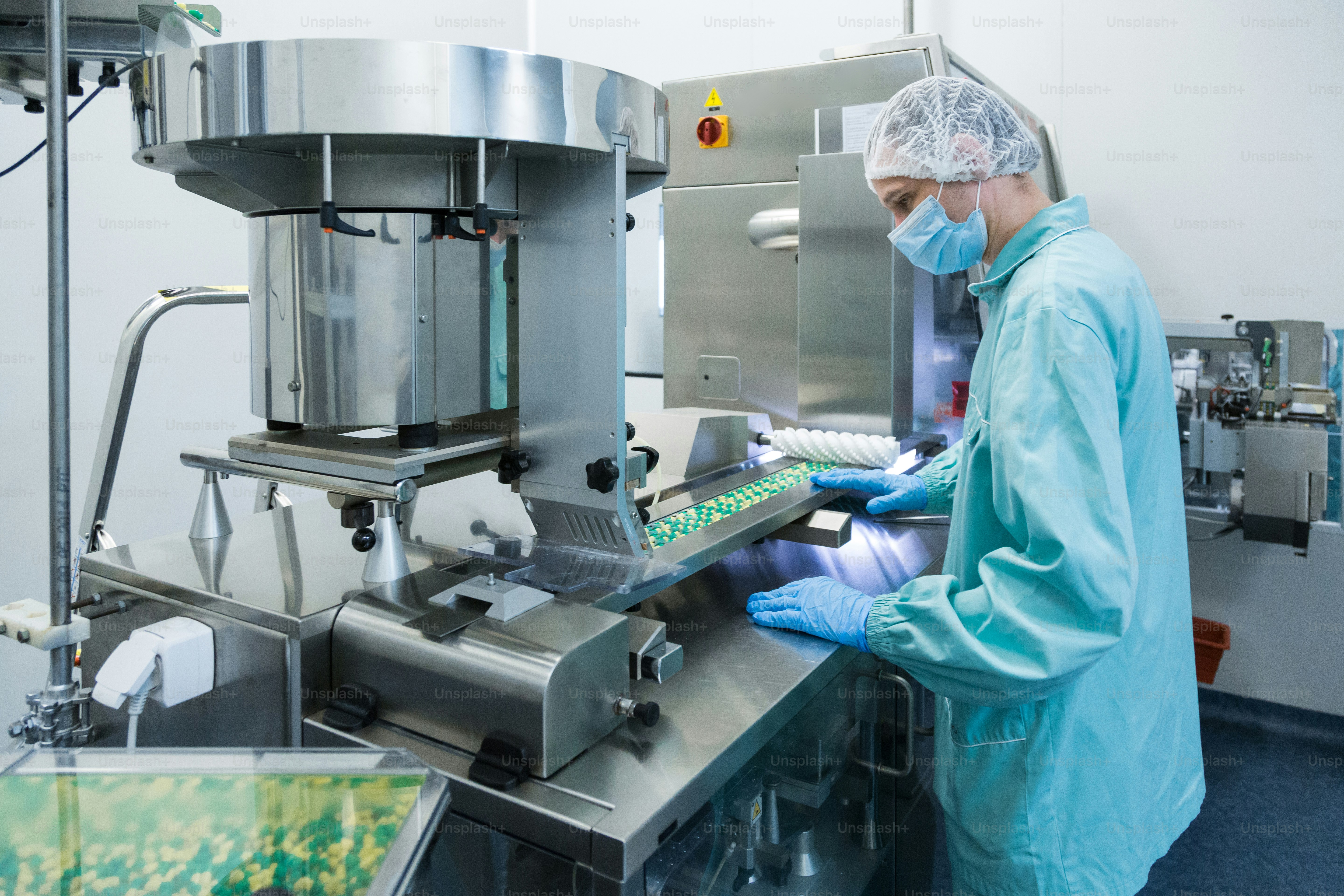 Pharmaceutical technician in sterile environment at pharmacy industry ...